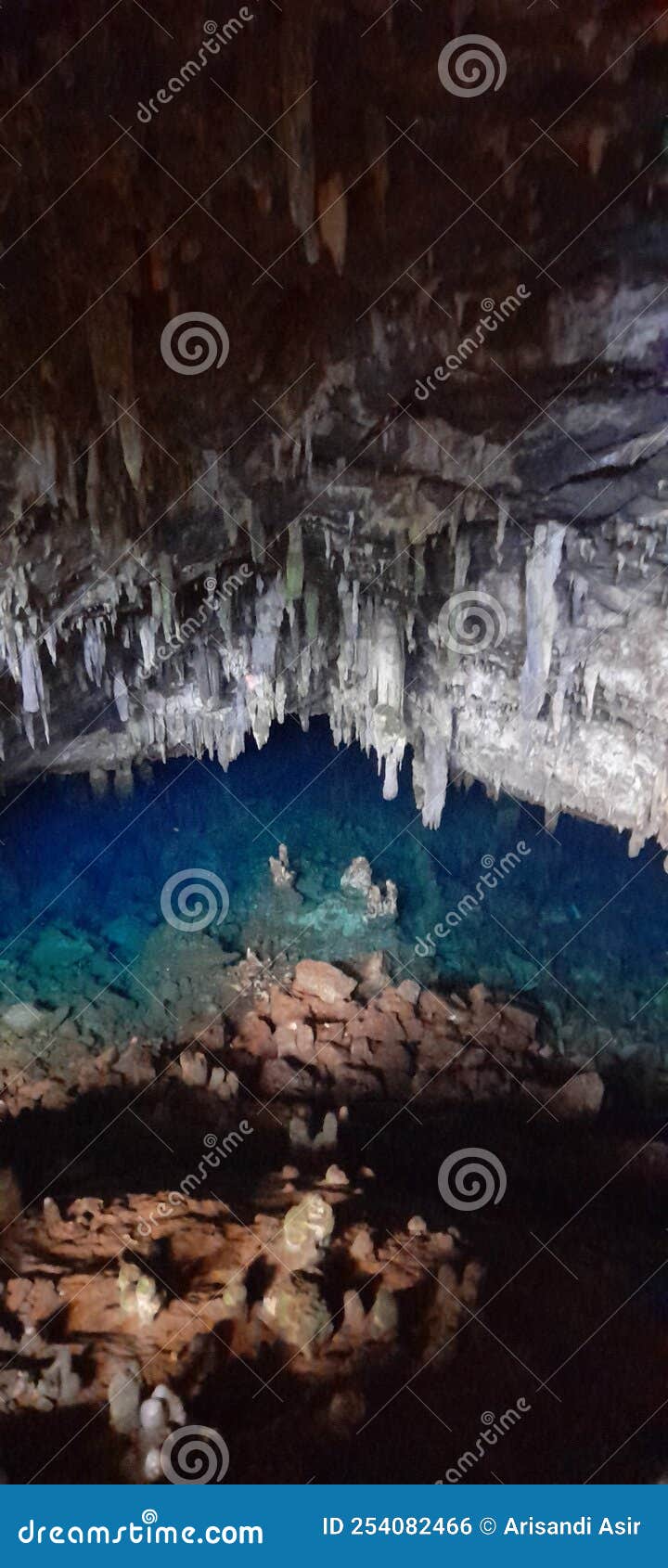 The Blue Water in the Cave Also Follows the Tides Stock Photo - Image ...