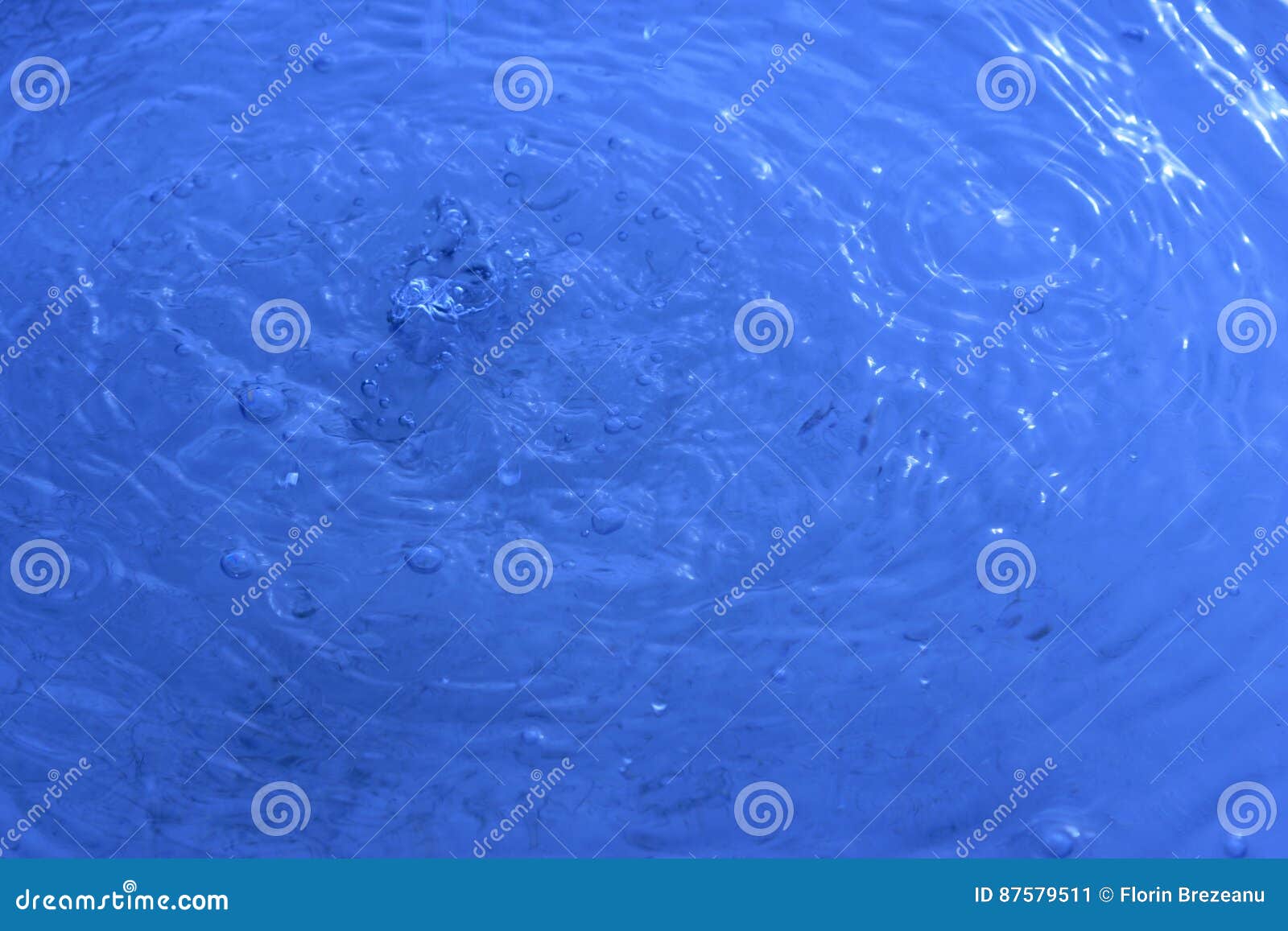 Blue Water Dripping - Splash Droplets with Small Waves Stock Image ...