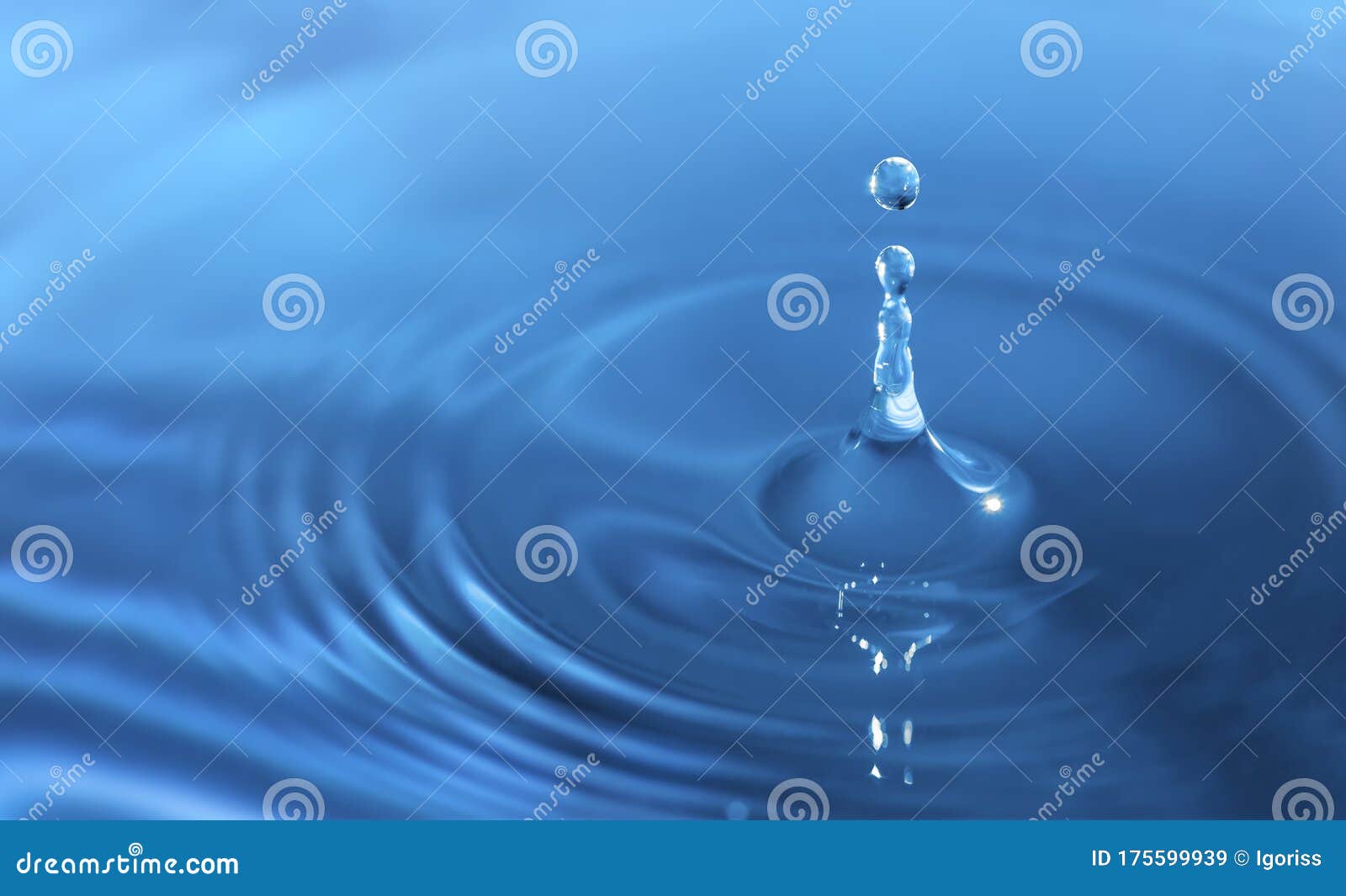 Blue Water Drop Falling into Water Making Splash and Ripples. Stock ...