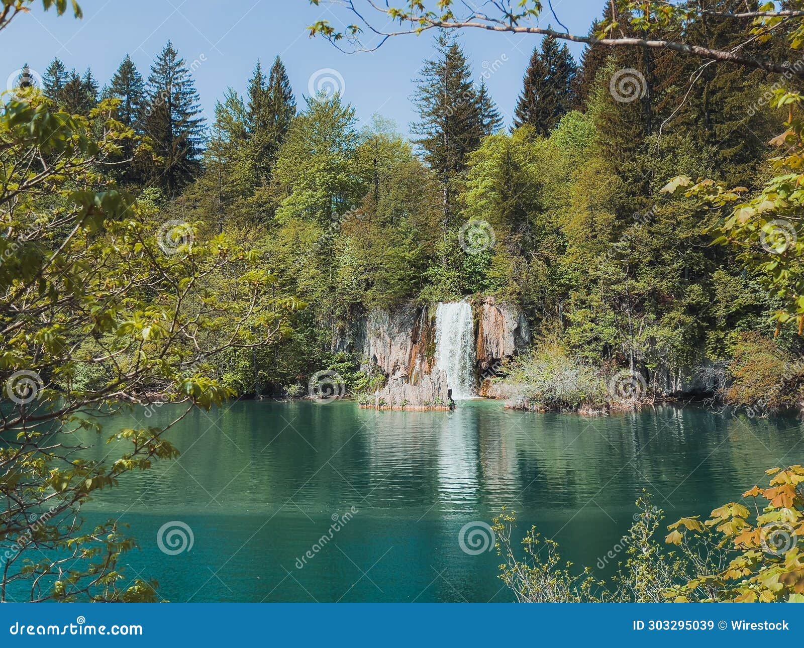 The Blue Water in the Lake and Some Trees in the Background Stock Image ...