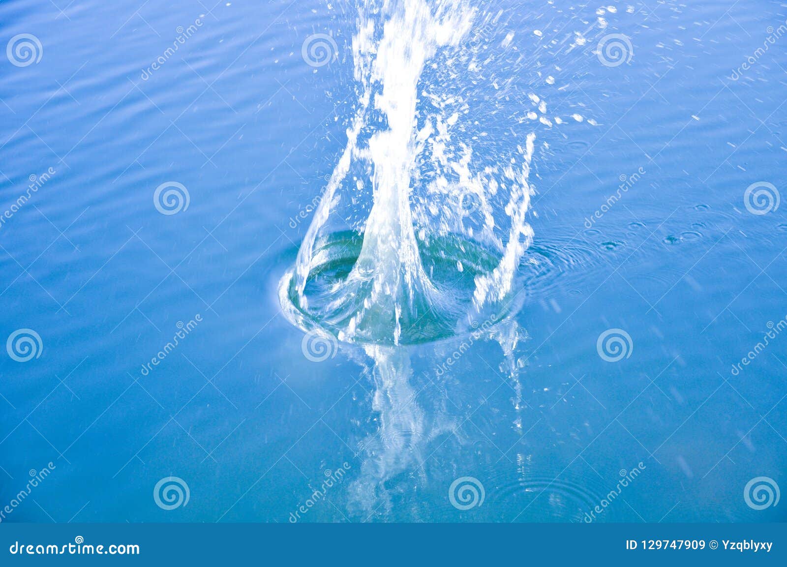 Water ripple and splash stock image. Image of tension - 129747909