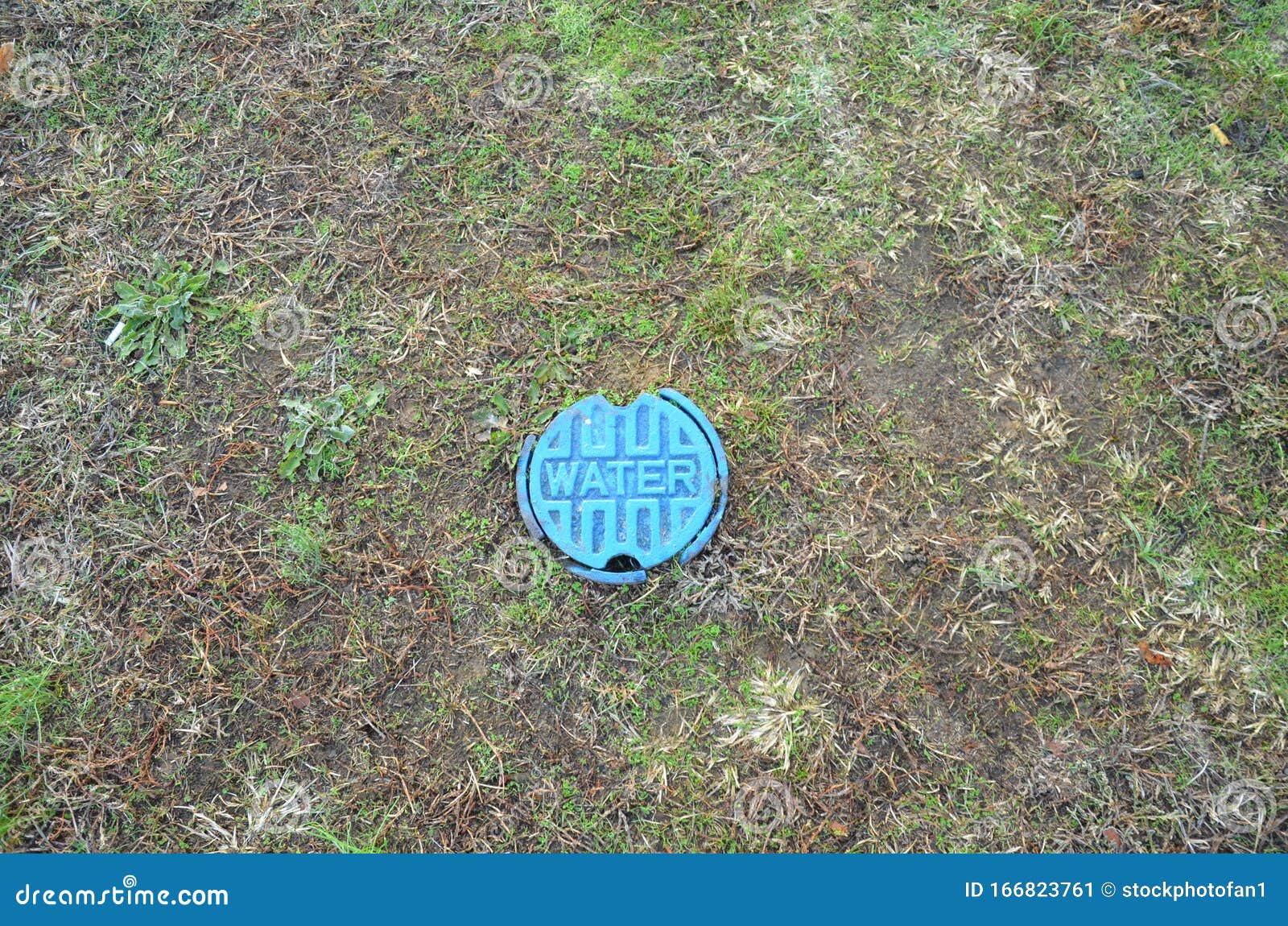 Blue Water Sign and Access Panel with Green Grass or Lawn Stock Image ...
