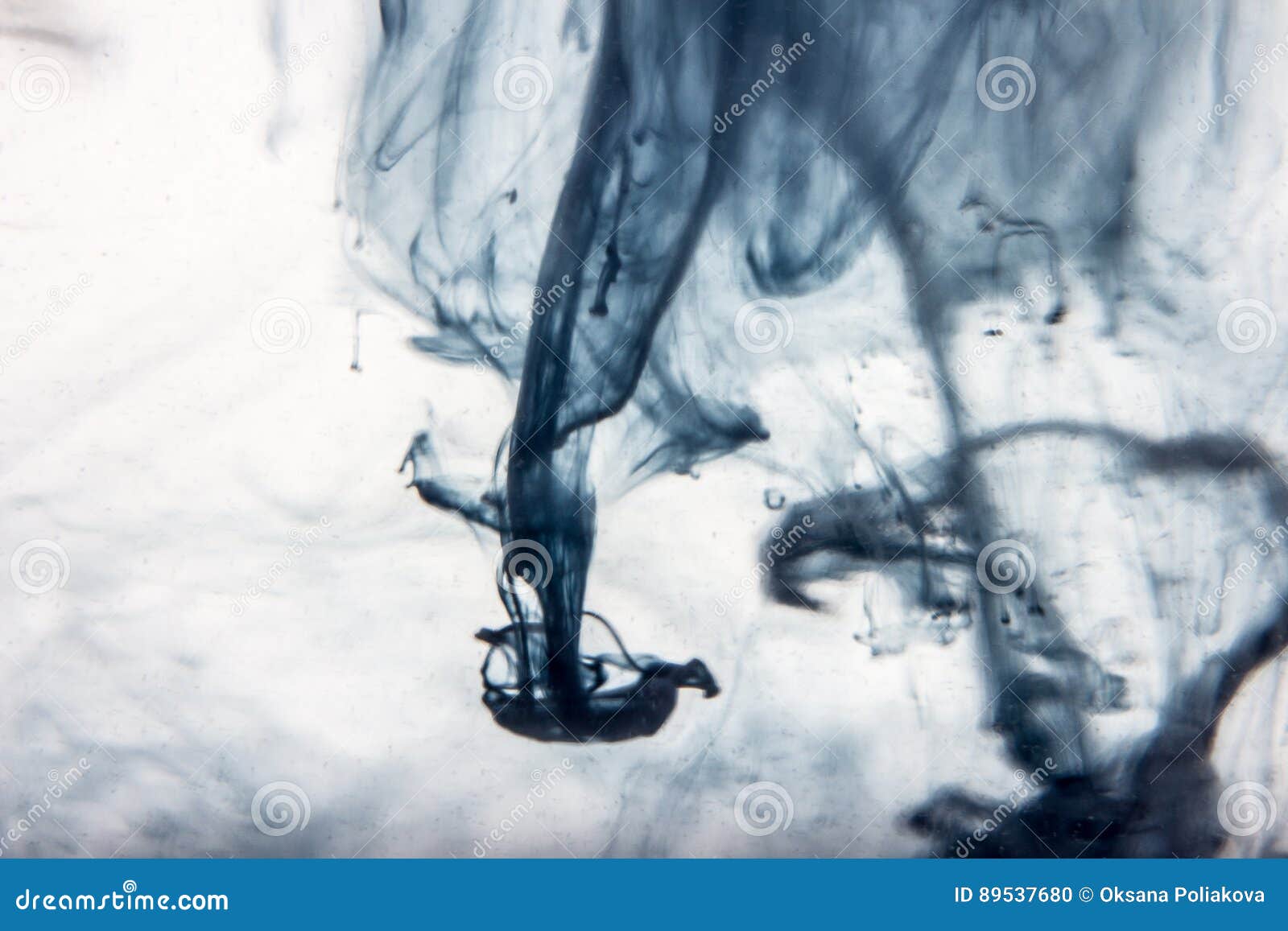 Blue Watercolor Paint Drops in Water with White Background Stock Photo ...