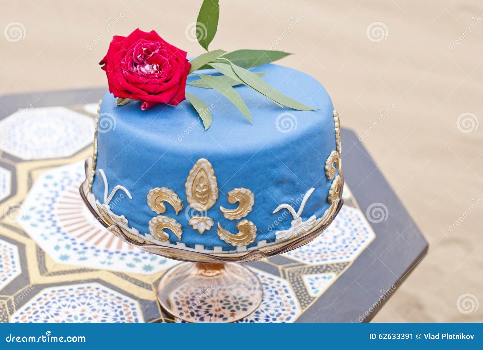 Blue Wedding Cake on a Table and Red Roses on Top Stock Image - Image ...