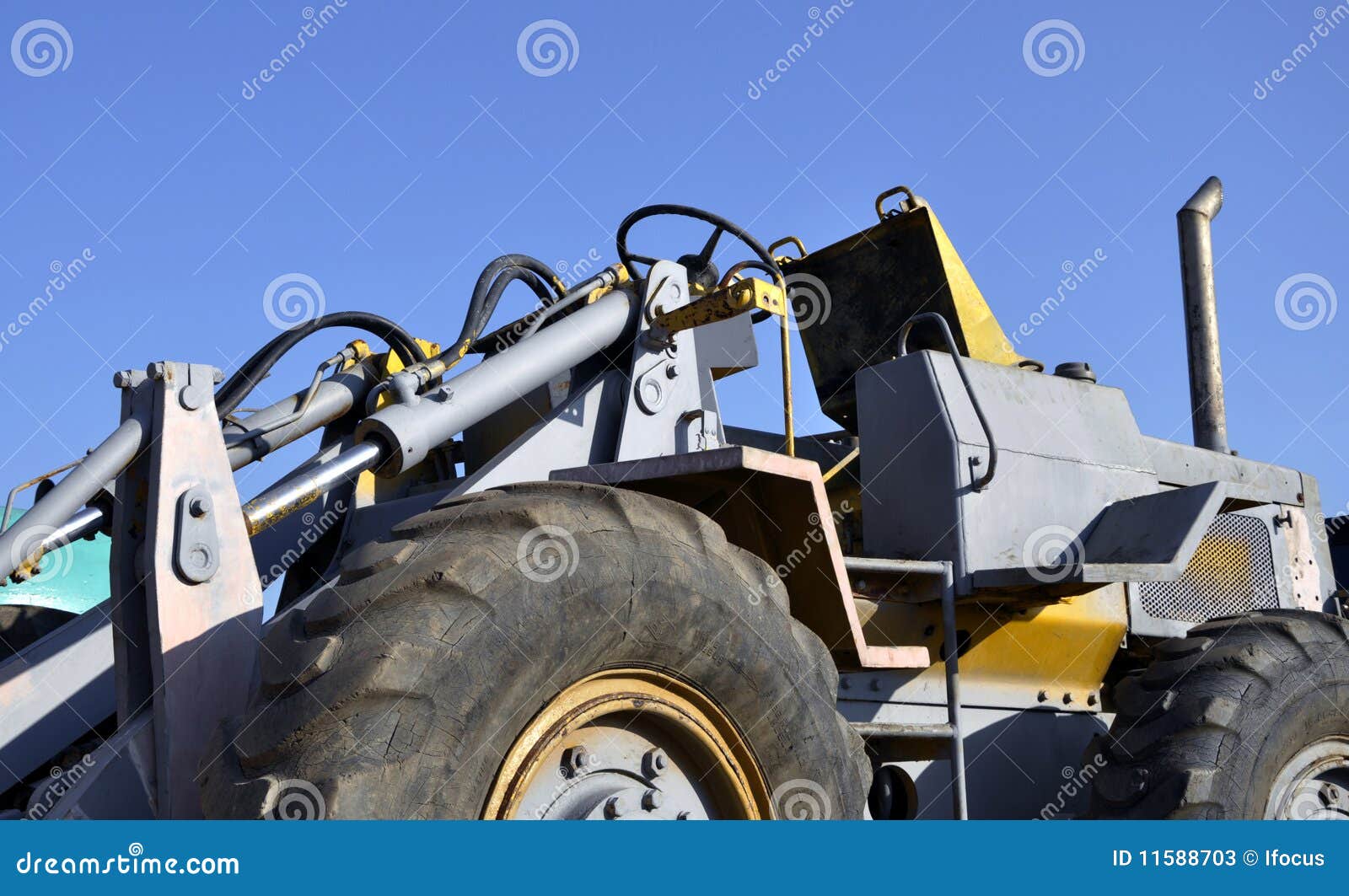 Blue Wheel Dozer stock image. Image of move, earth, loader - 11588703