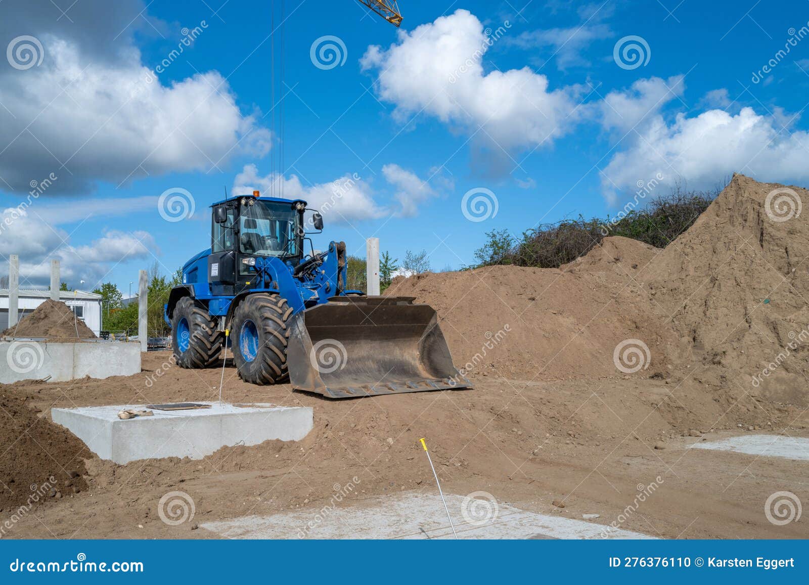 A Blue Wheel Loader Stands on a Construction Site Editorial Image ...
