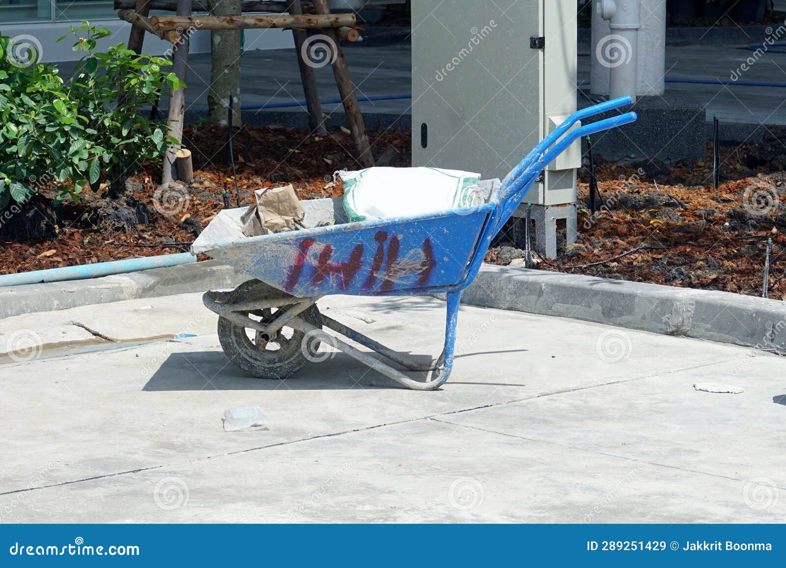 A Blue Wheelbarrow for Construction Work at the Construction Site Stock ...
