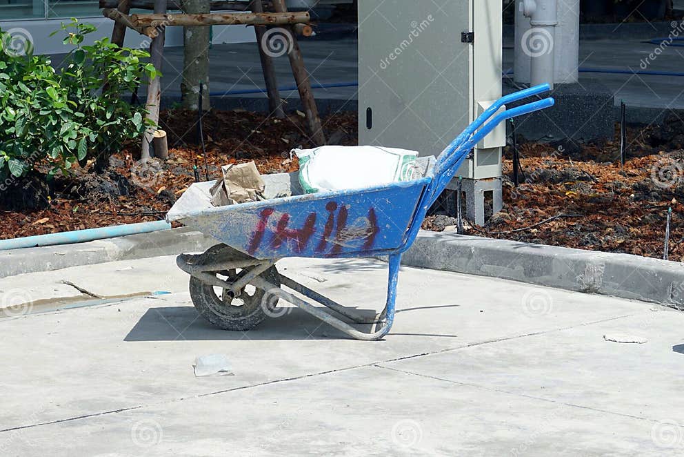 A Blue Wheelbarrow for Construction Work at the Construction Site Stock ...