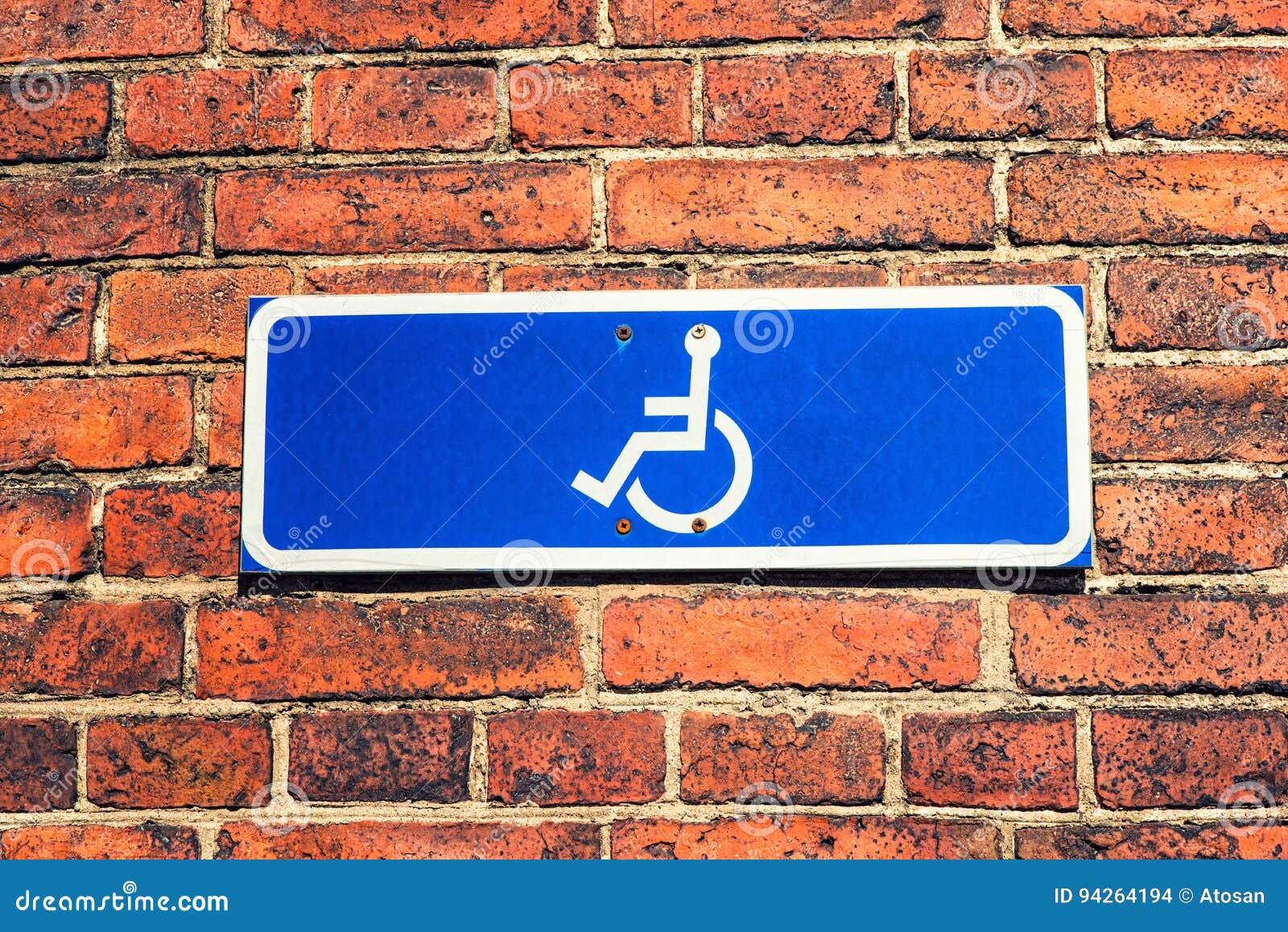 A Blue Wheelchair-Disabled Sign Stock Photo - Image of brick, reserved ...