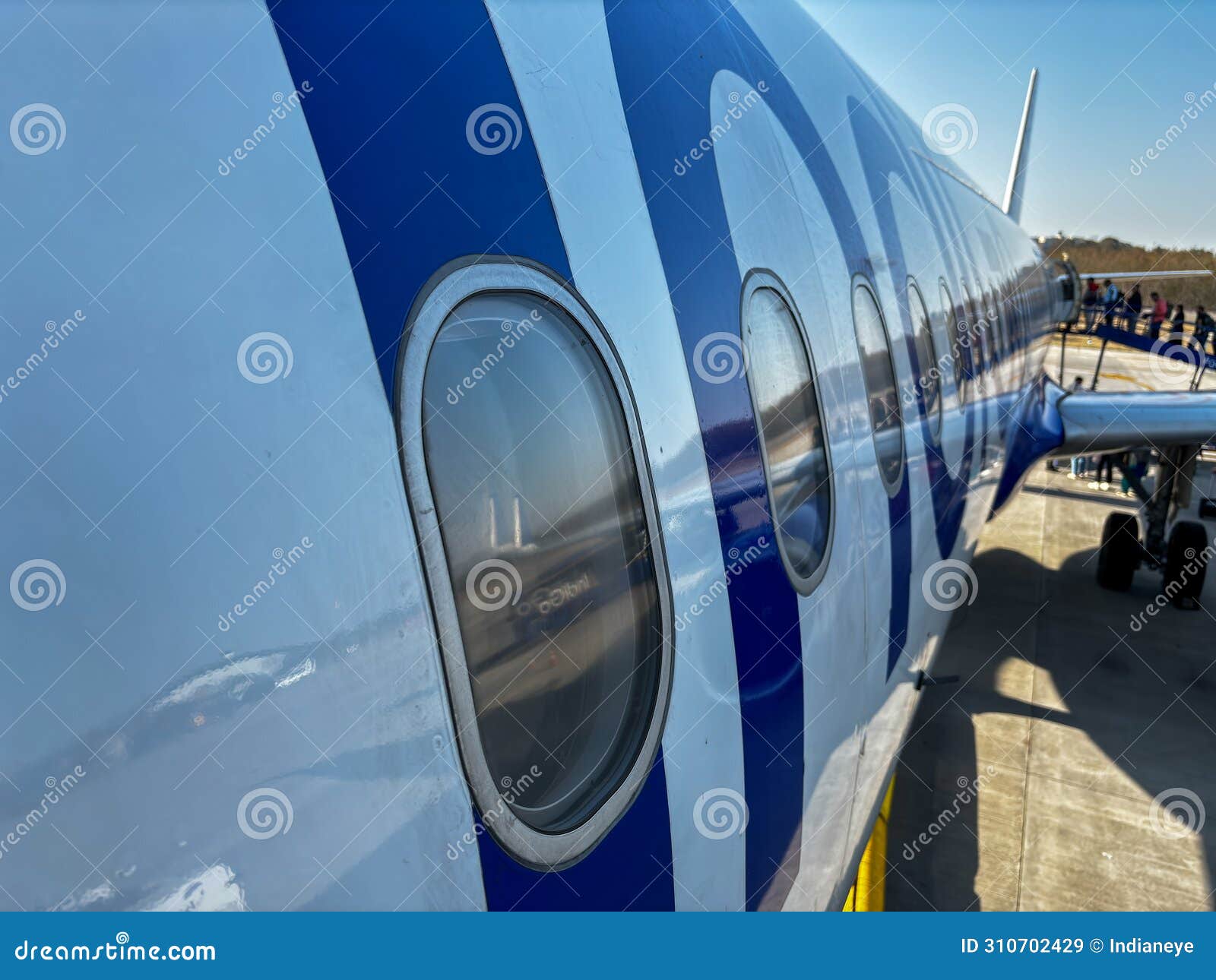 The Blue and White Airplane Has a Large Window on the Side Stock Image ...