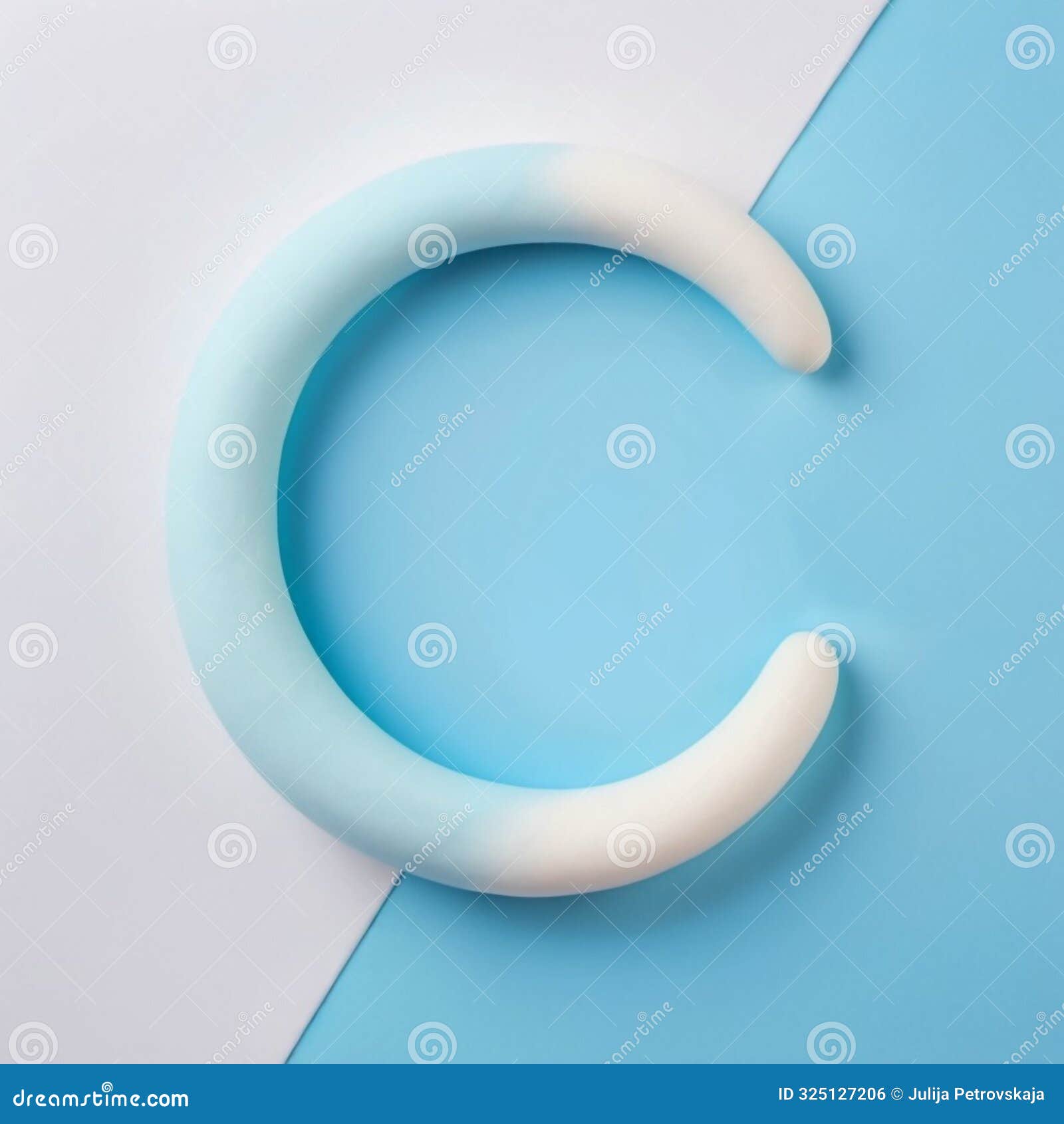 Blue and White Curved Object, Resembling Letter C, is Placed on Split ...
