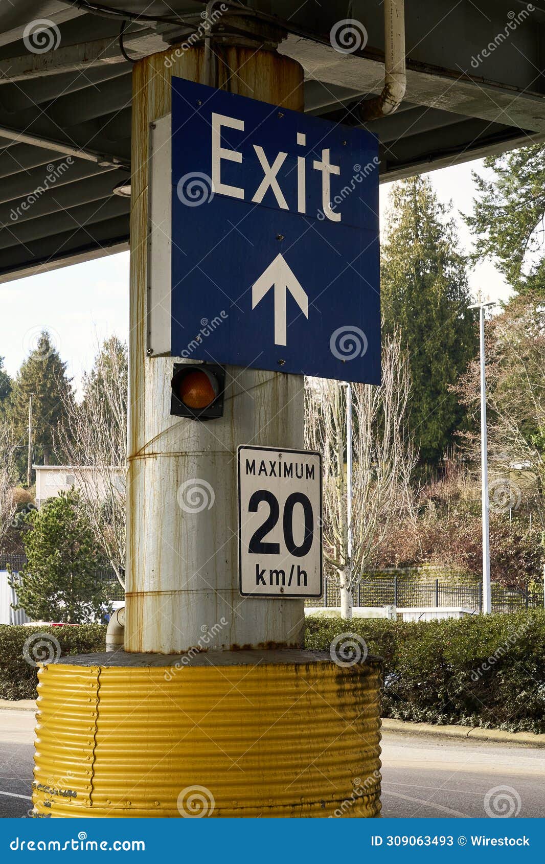 A Blue and White Exit Sign with an Arrow Pointing the Direction and a ...