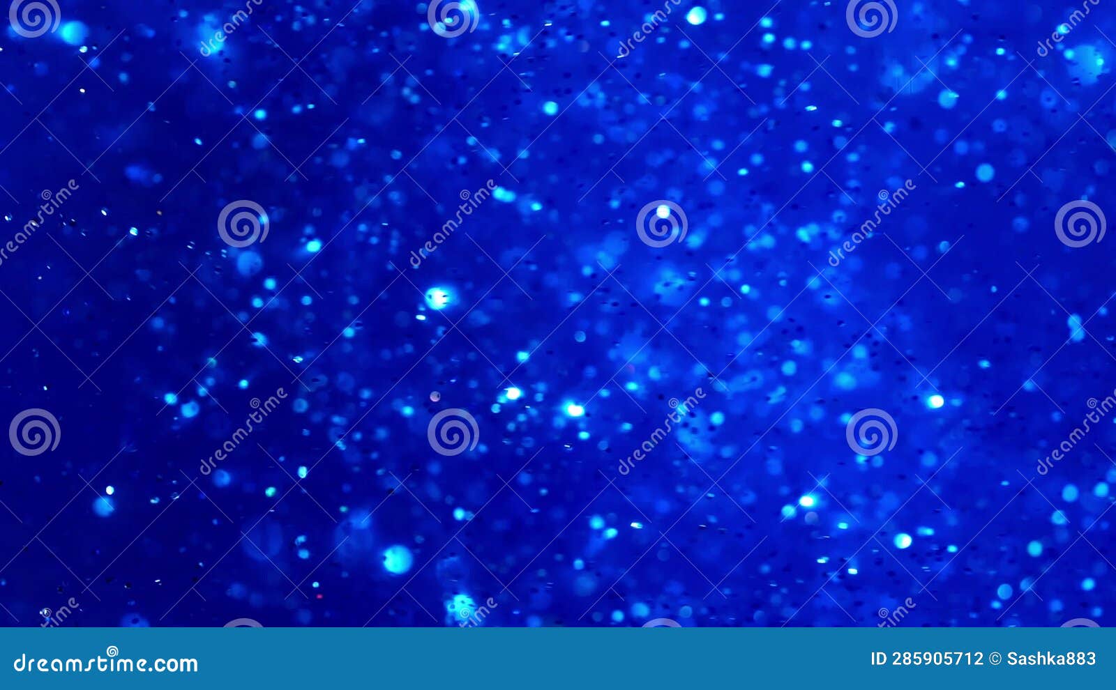 Blue and White Floating Particles Shimmering in Blue Liquid. Stock ... Blue and White Floating Particles Shimmering in Blue Liquid. Stock ...