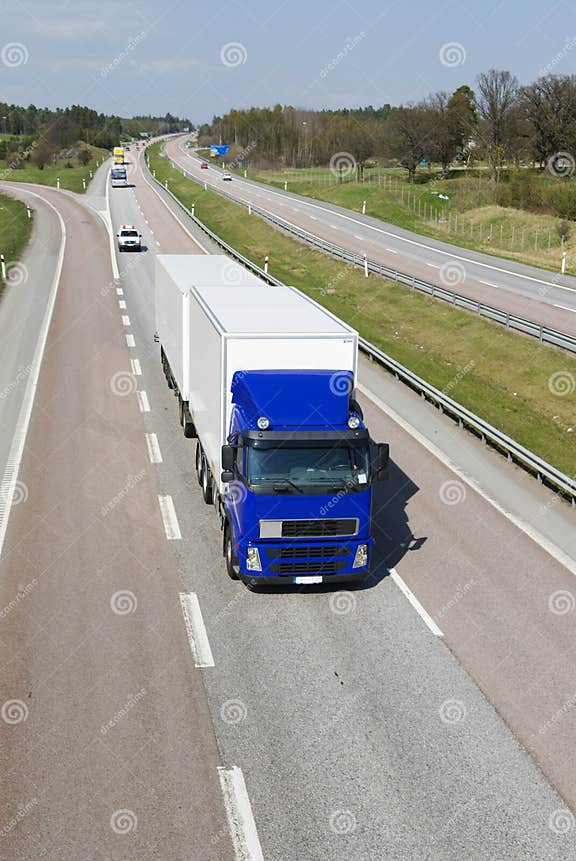 Blue and White Lorry on Highway Stock Photo - Image of travel, cargo ...