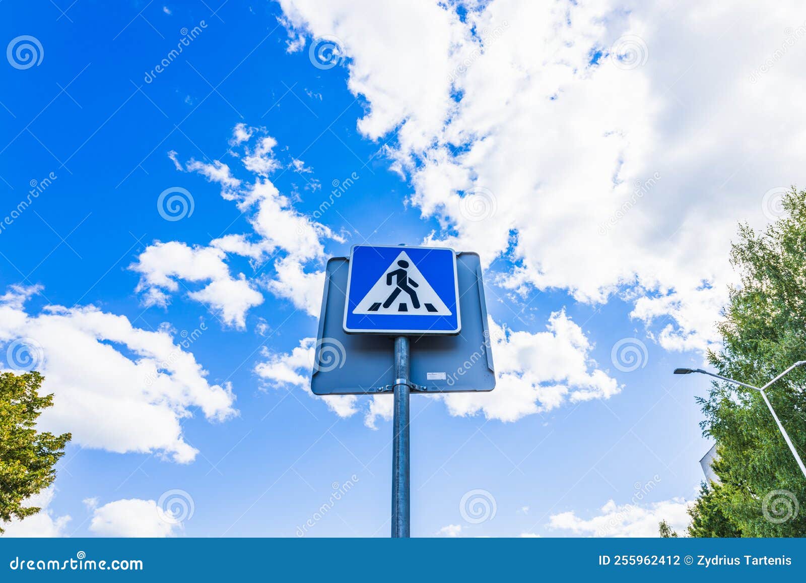 Blue and White Pedestrian Crossing Sign on the Sky Background Stock ...