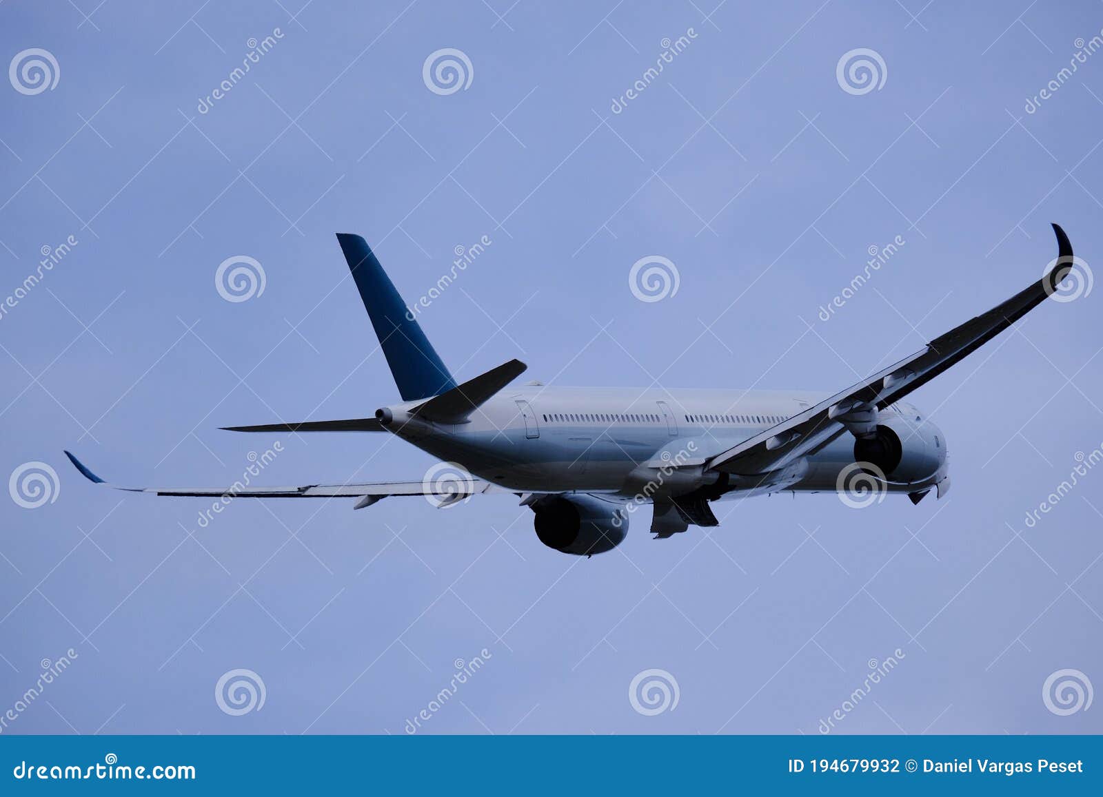 Blue and White Plane Taking Off Stock Photo - Image of blue ...
