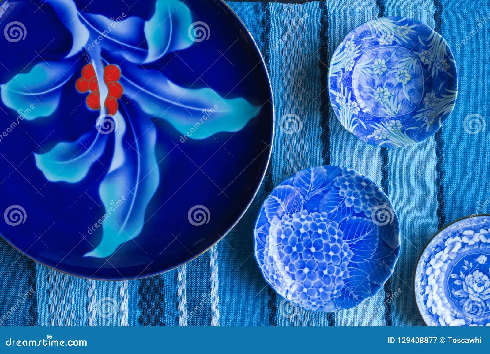 Blue and White Plates on Blue Textured Table Cloth - Top View Ph Stock ...