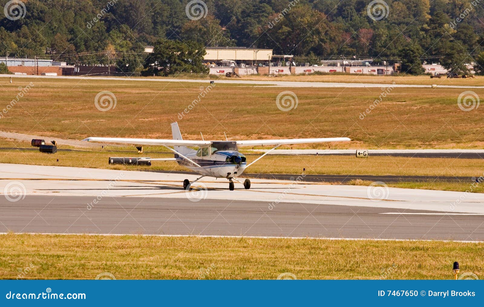 Blue and White Prop Plane on Runway Stock Photo - Image of airplane ...