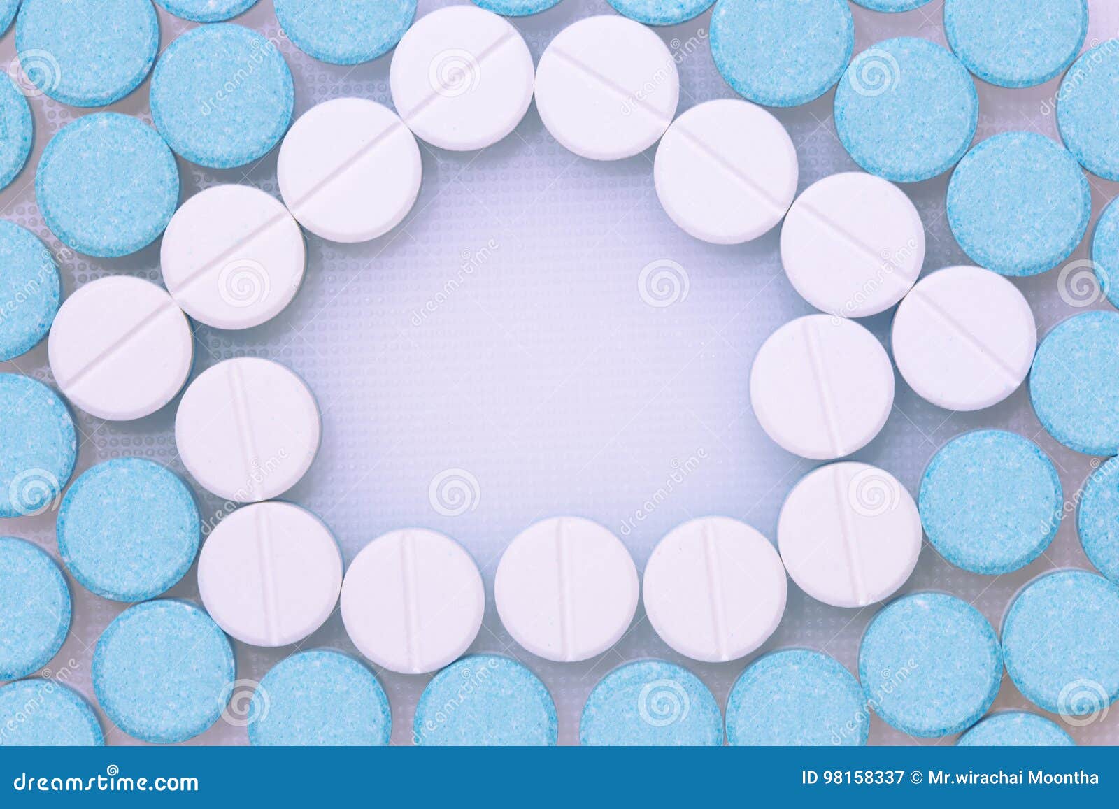 Blue and white round pills stock image. Image of care - 98158337