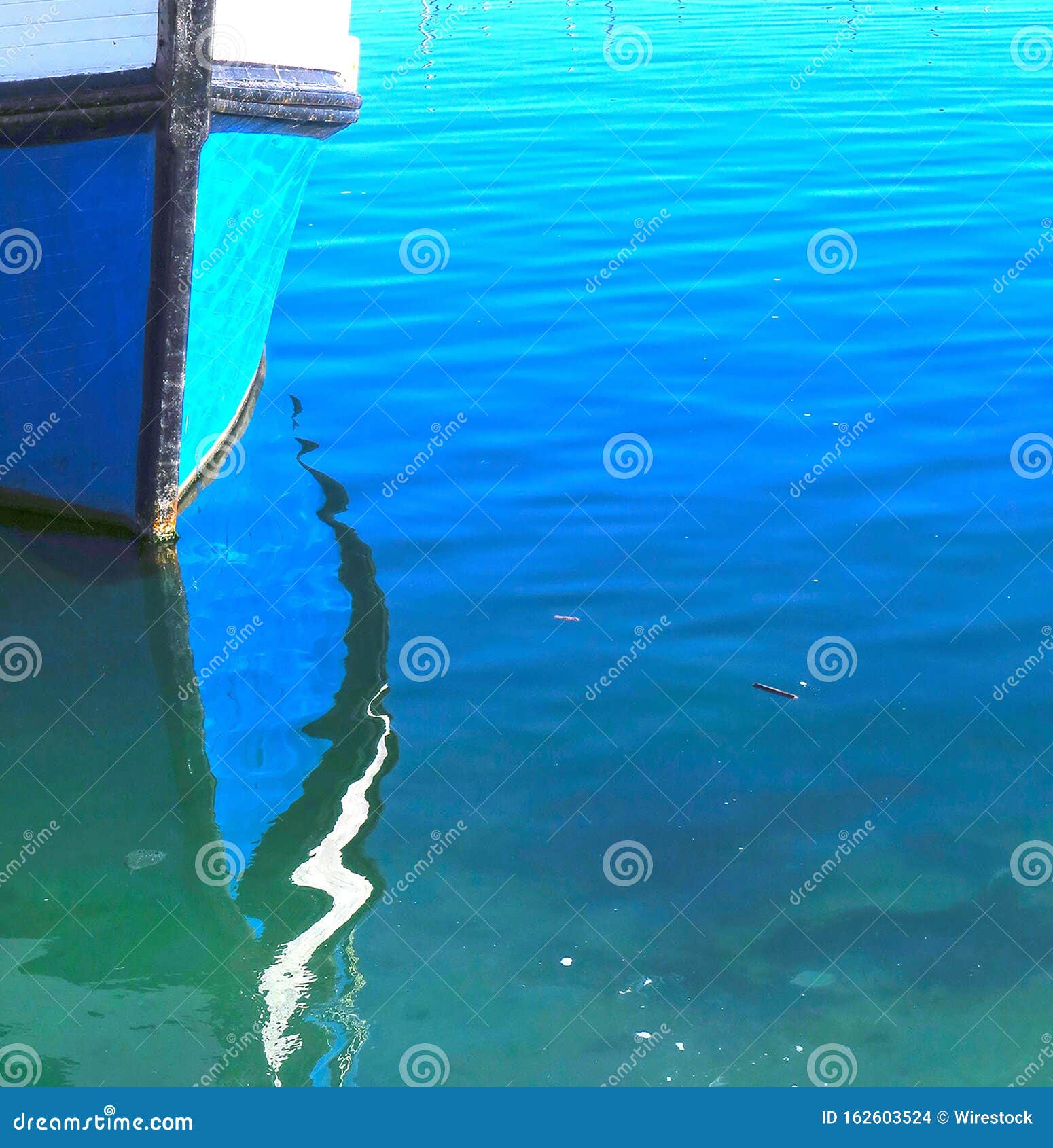 Blue and White Ship Getting Ready To Sail in the Blue Sea Stock Photo ...