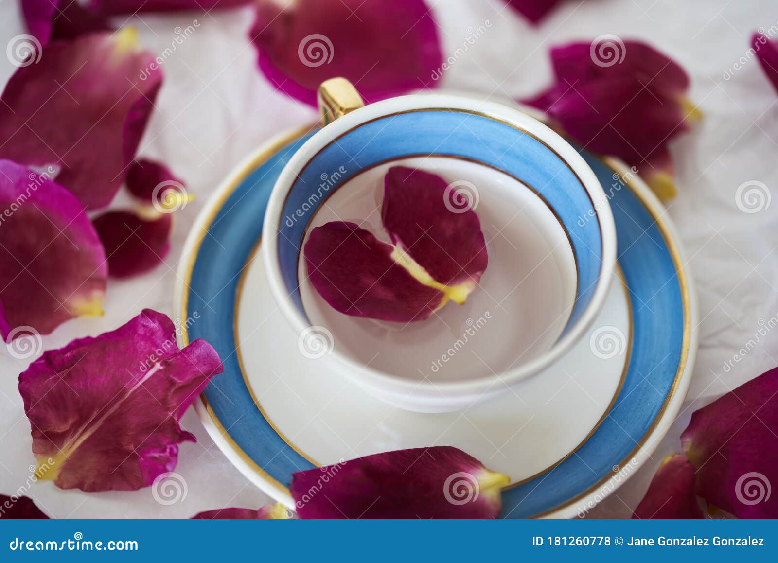 Blue and White Tea Cup with Rose Petals Stock Photo - Image of shape ...