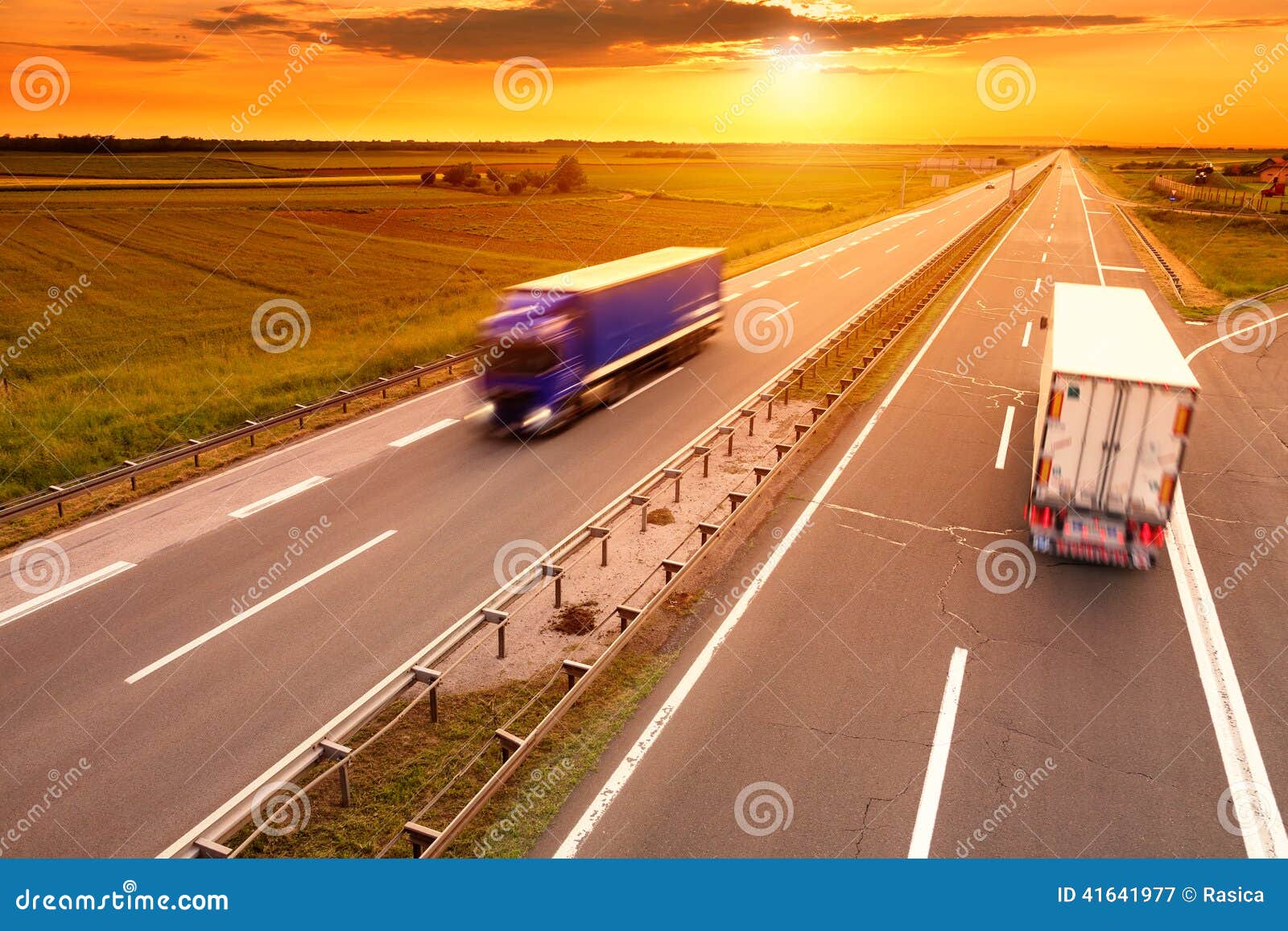 Blue Big Rig Tow Truck Towing Broken Big Rig Semi Truck Driving On The ...