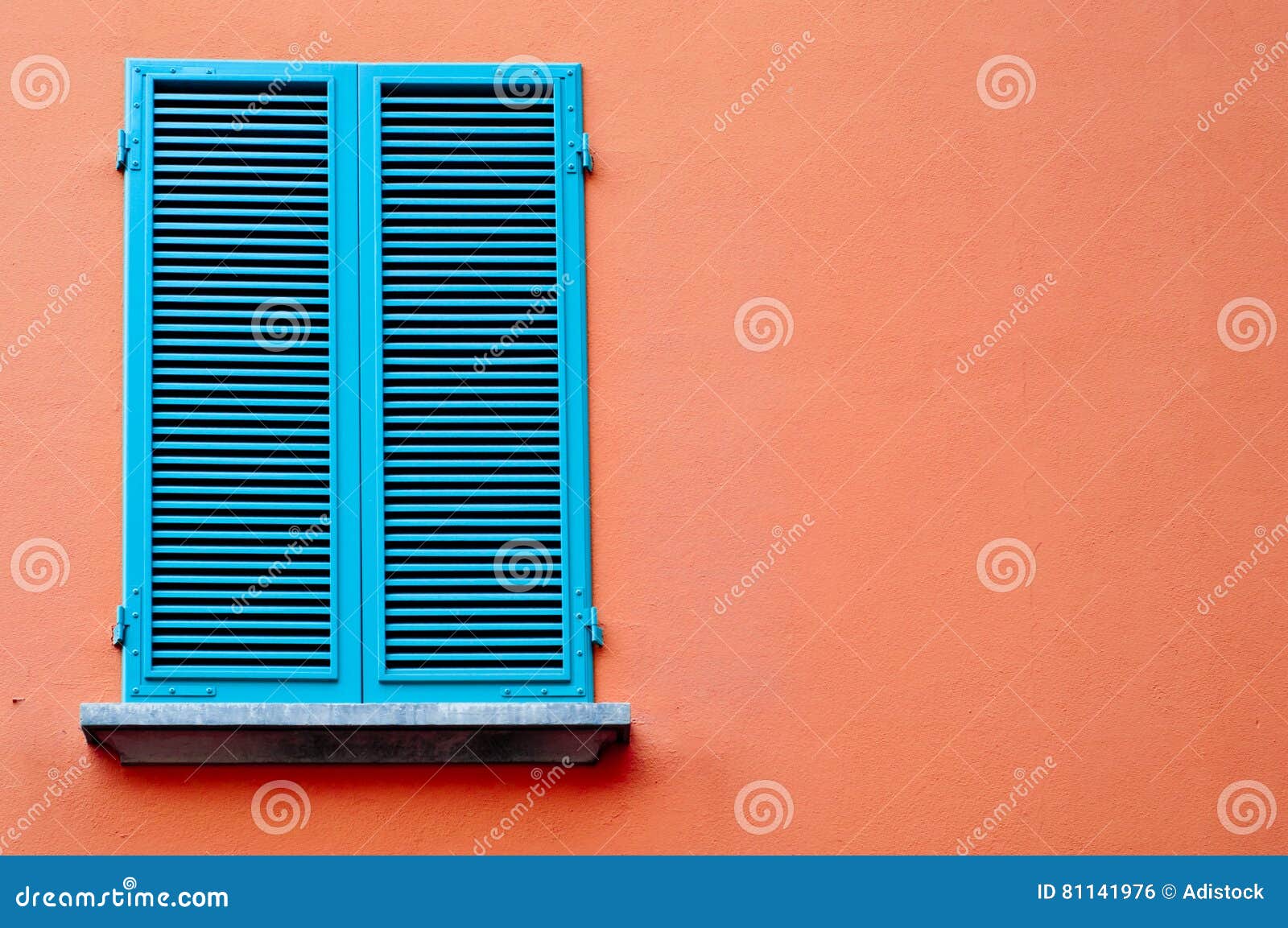 Blue window on orange wall stock photo. Image of cement - 81141976