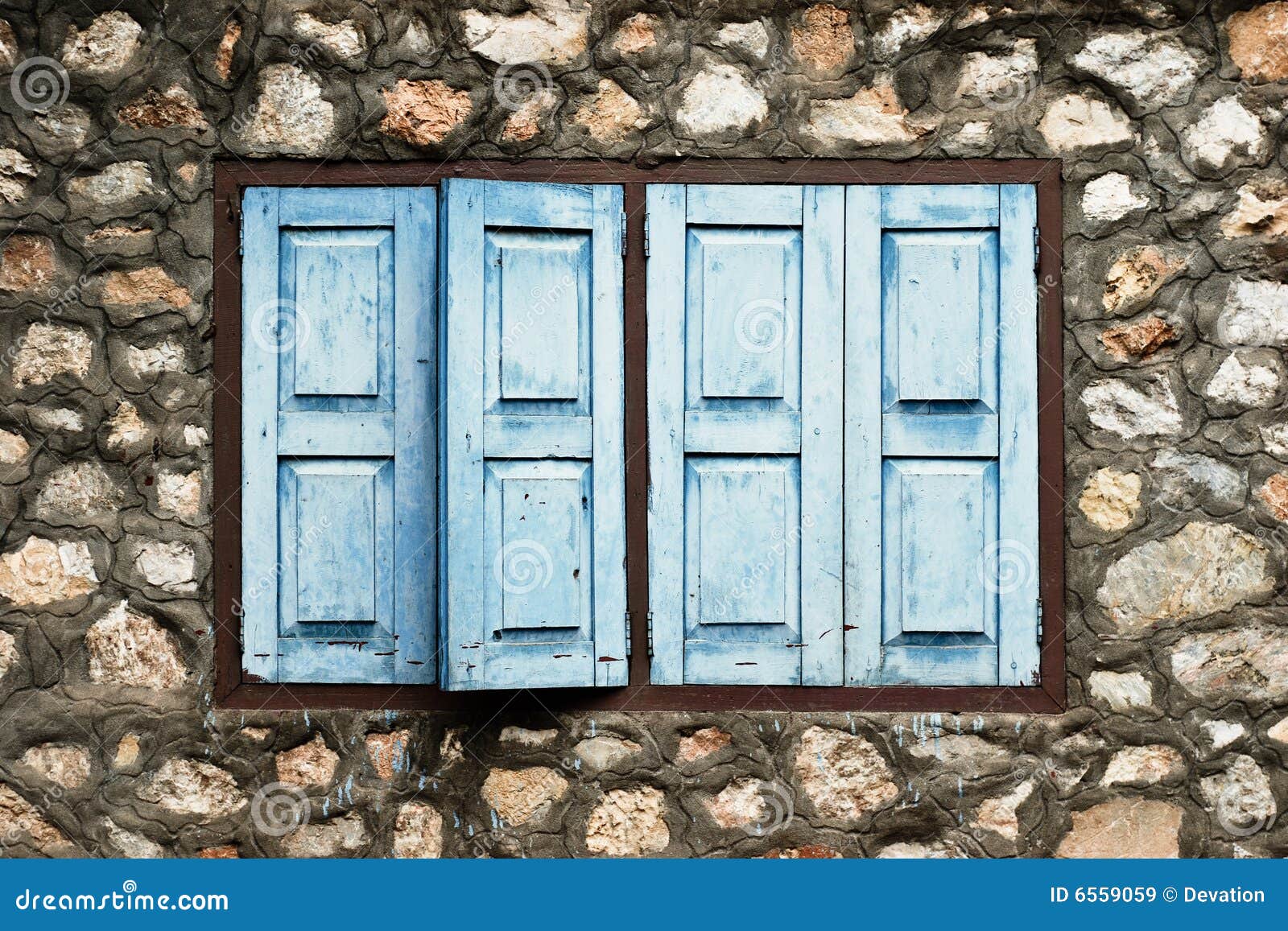 Blue window on stone wall stock image. Image of brown - 6559059