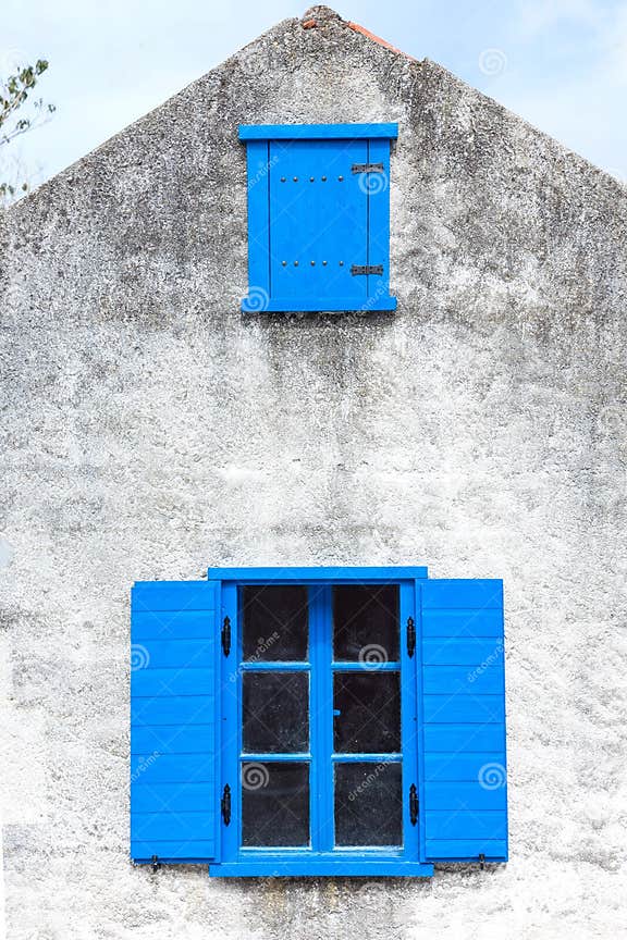 Blue windows on the wall stock photo. Image of texture - 156698920