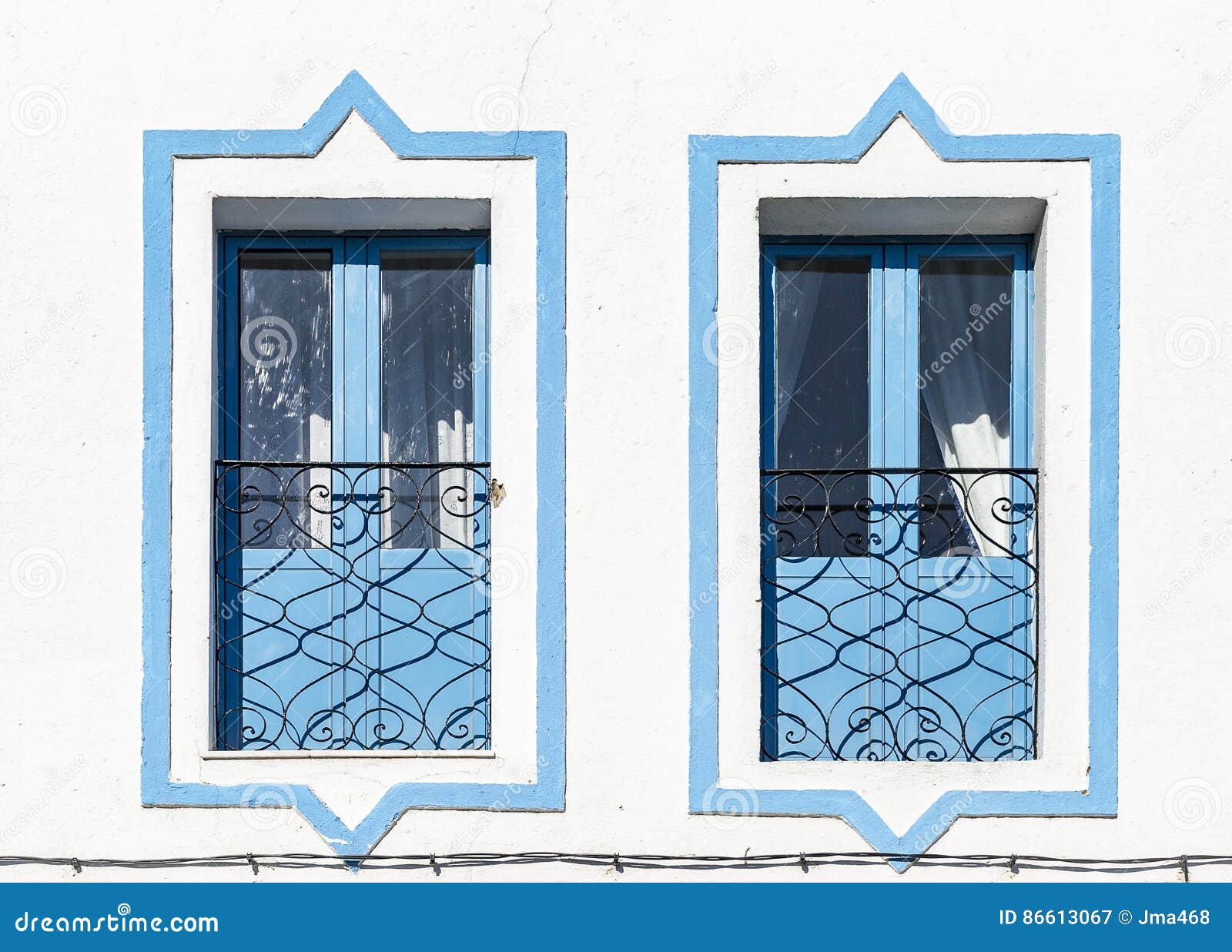 Blue Windows on a White Wall Stock Image - Image of window, background ...