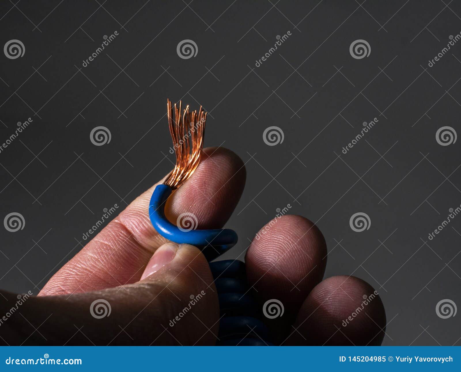 Two Bare Electrical Wires, On A Gray Background. Stock Photo ...
