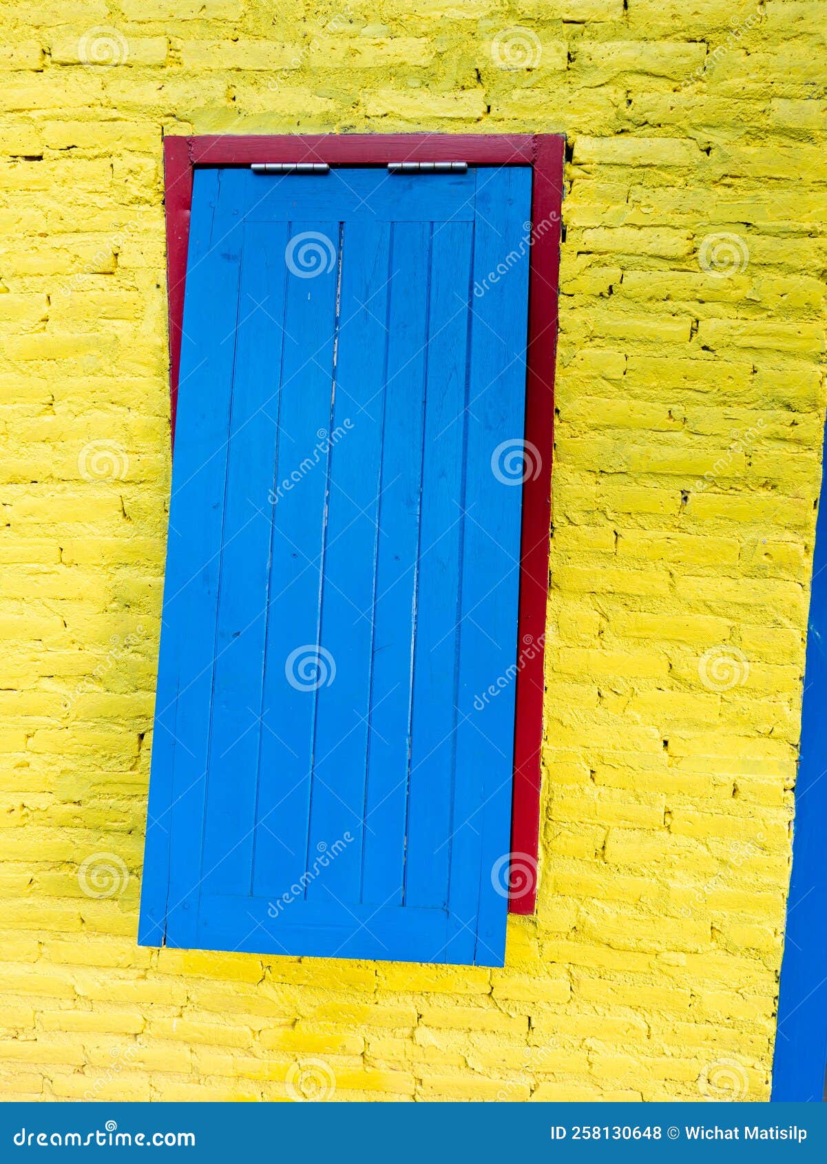 Blue Wooden Window on the Red Frame in the Yellow Wall Stock Photo ...