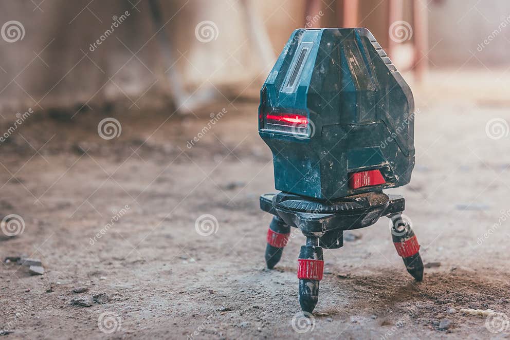 Blue Working Laser Level Construction Tool and Line on the Wall Stock ...