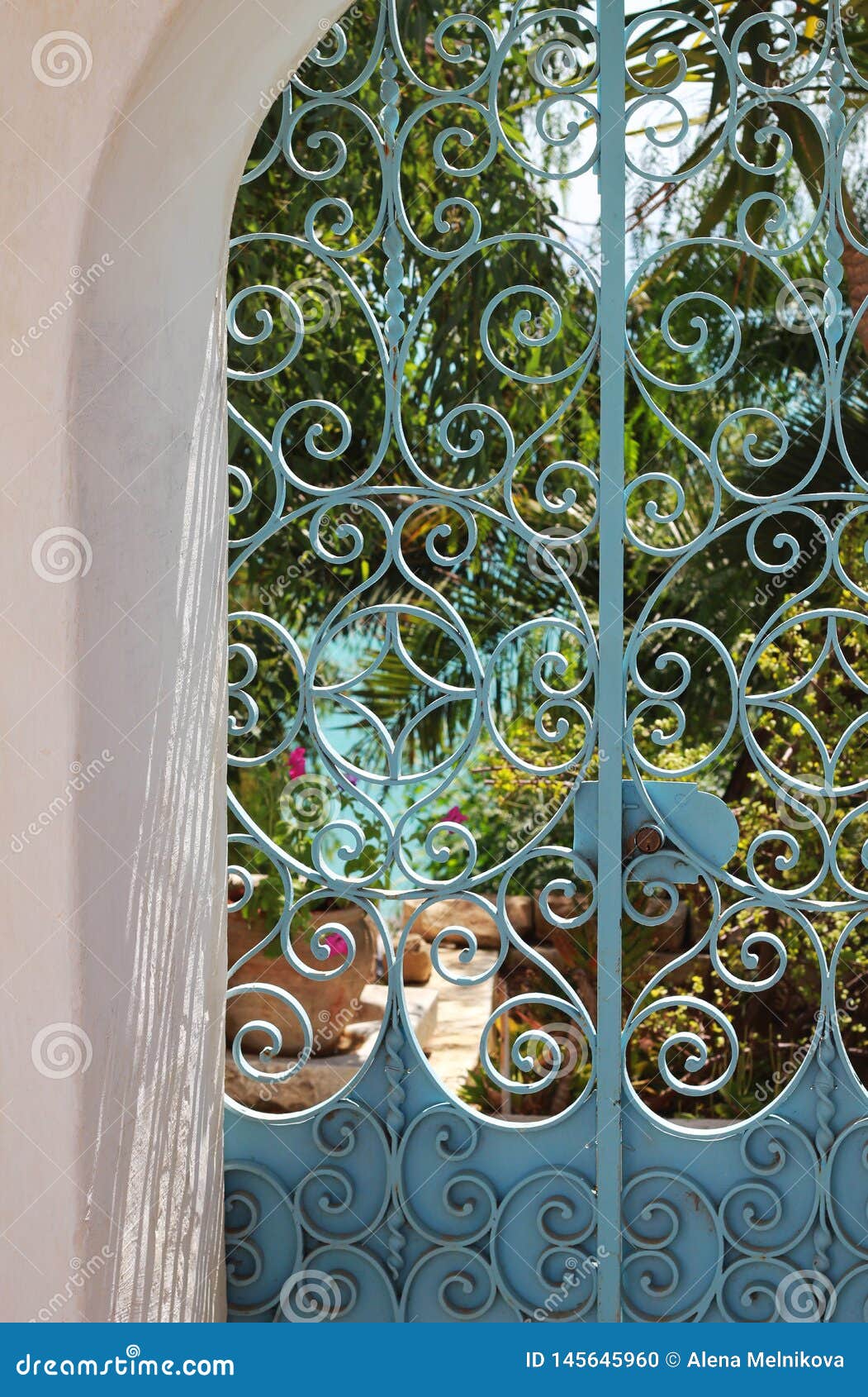 Blue Wrought Iron Gate in the Shape of an Arch Stock Photo - Image of ...