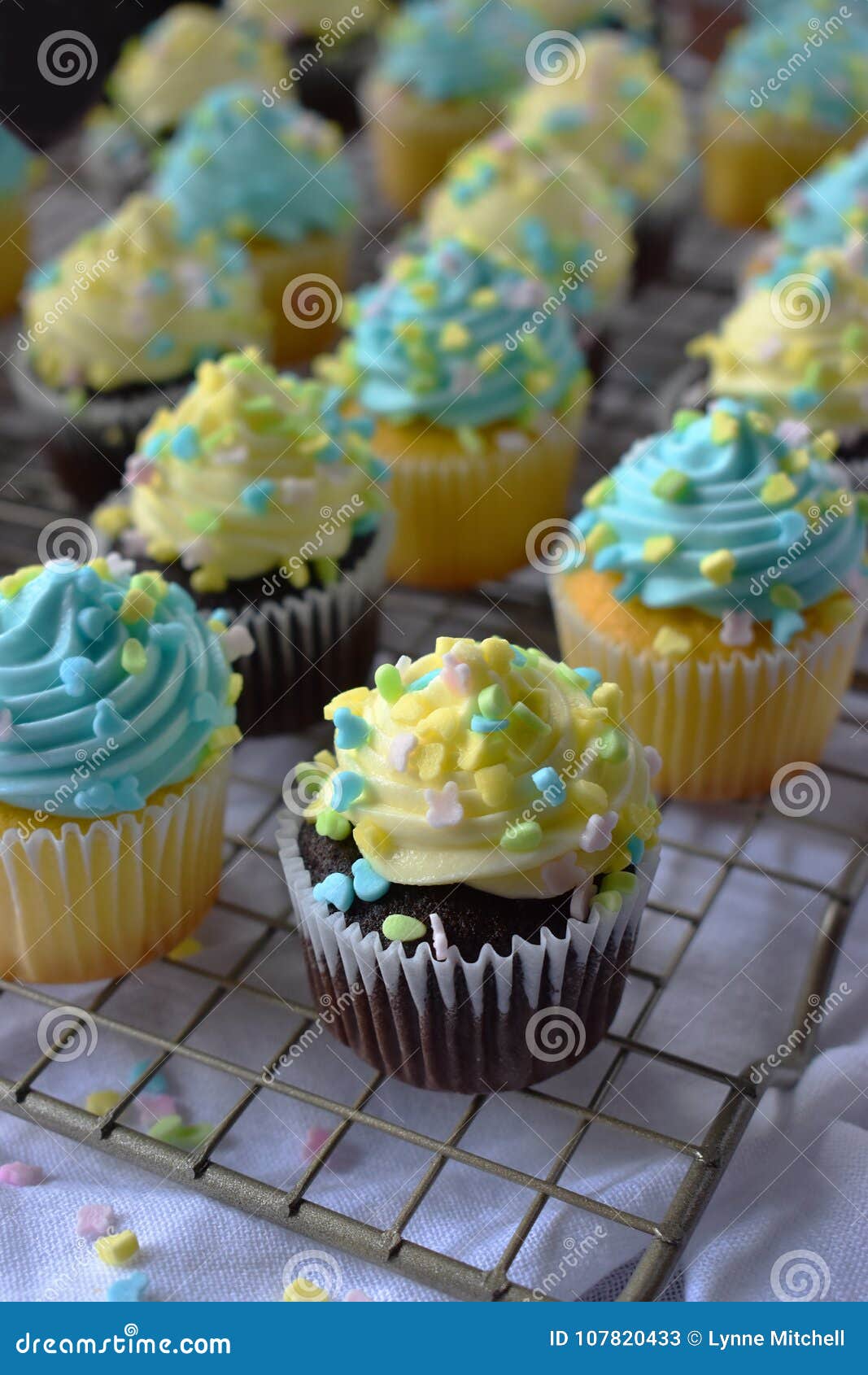 Blue and Yellow Cupcakes with Spring Sprinkles Vertical Layout Stock ...