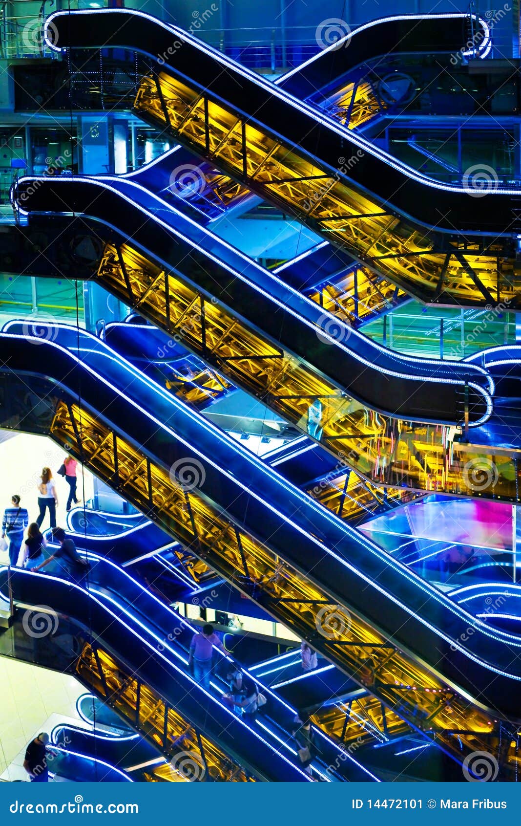 Blue and yellow escalators stock image. Image of mall - 14472101