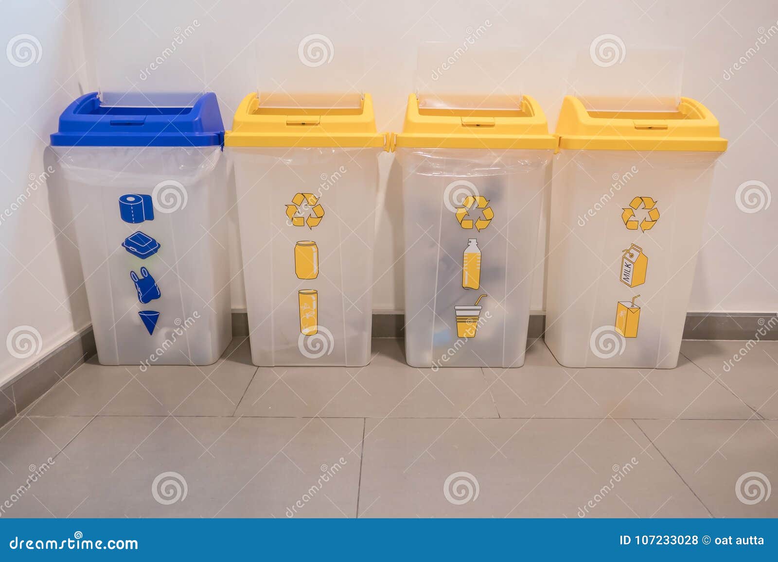 Blue and Yellow Garbage Containers for Recycling Stock Photo - Image of ...