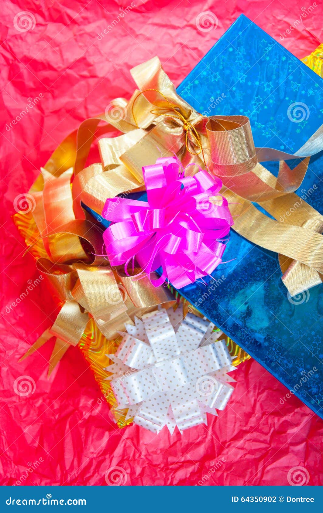 Blue and Yellow Gift Box on Red Stock Photo - Image of depth, ribbon ...