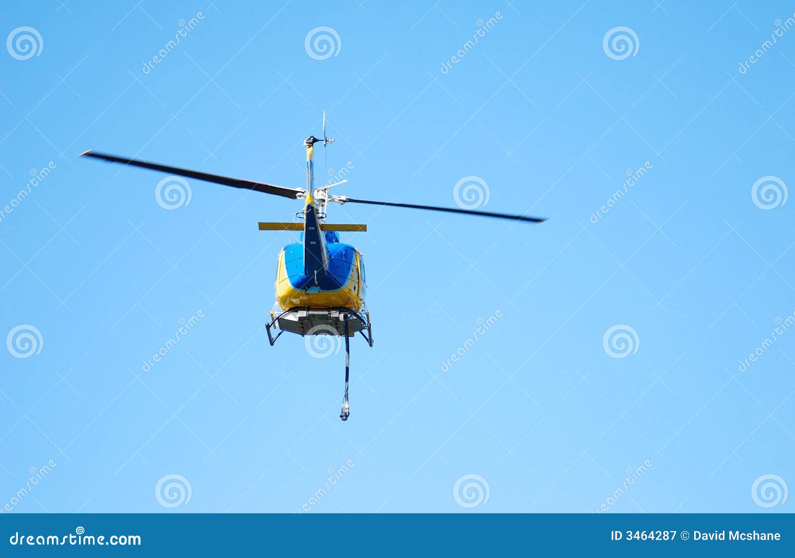 Blue and Yellow Helicopter stock image. Image of blades - 3464287