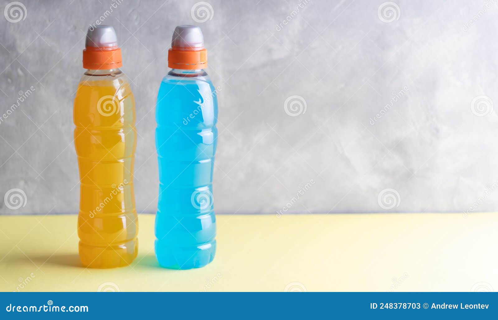 Blue and Yellow Isotonic Drinks with Copyspace Stock Image - Image of ...