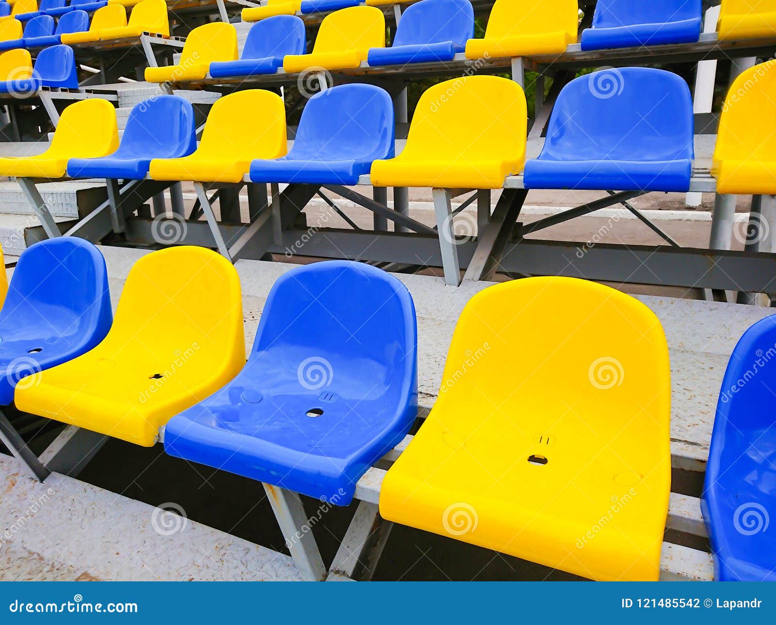 Blue and Yellow Plastic Chairs on the Street or at the Stadium Stock ...