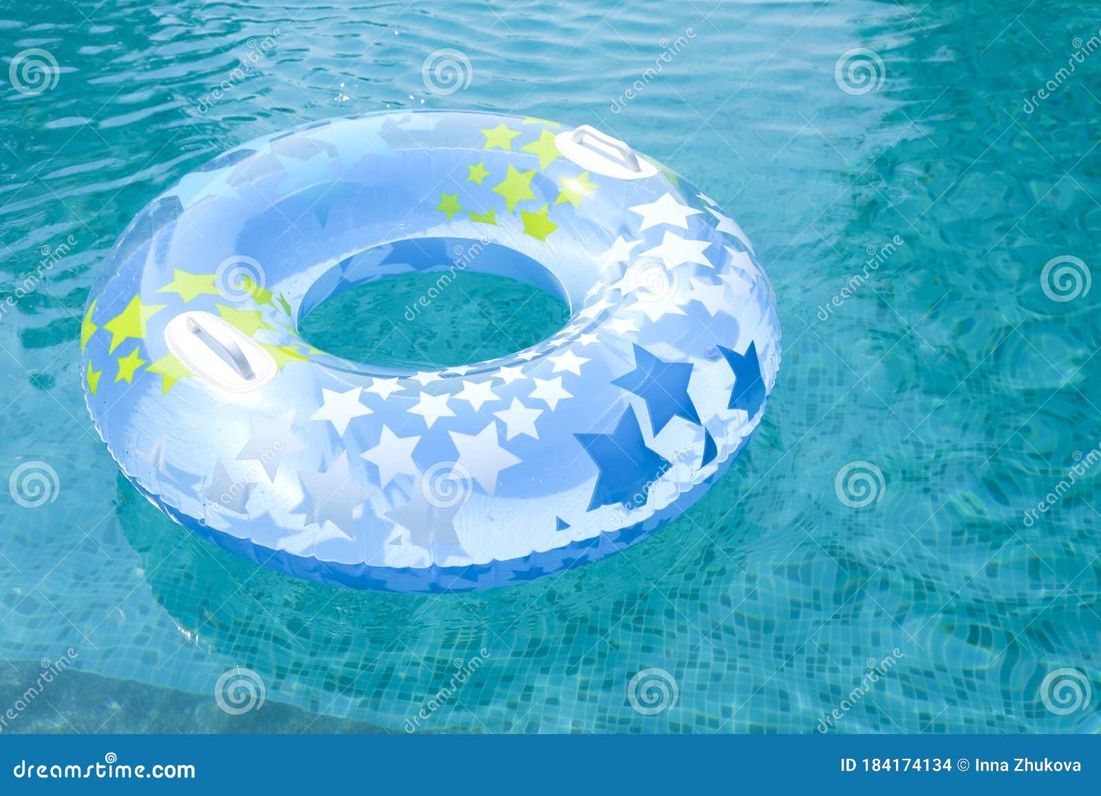 Blue and Yellow Pool Float, Ring Floating in a Refreshing Blue Swimming ...
