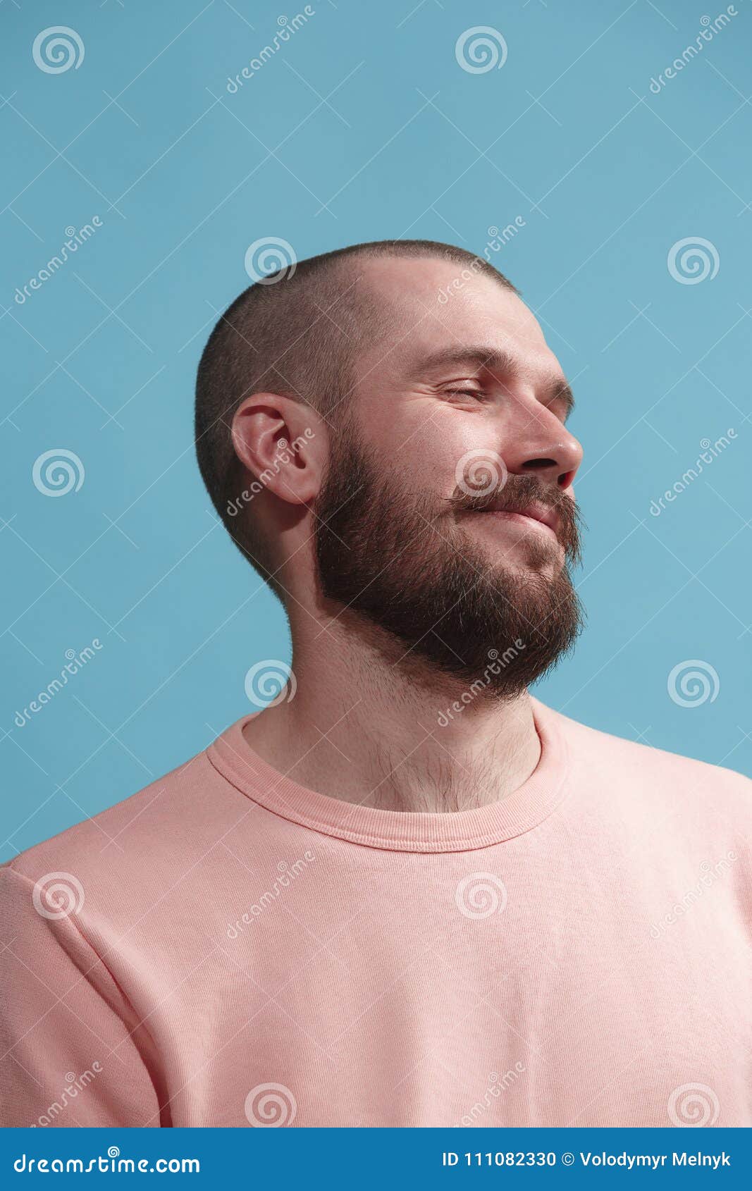 On Blue Young Casual Man Smiling and Enjoying at Studio Stock Photo ... On Blue Young Casual Man Smiling and Enjoying at Studio Stock Photo ...