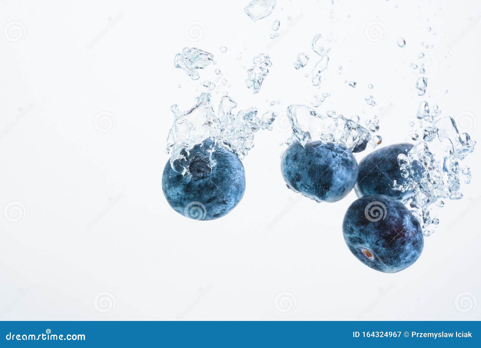 Blueberries Sinking Underwater with Air Bubbles Isolated on White ...