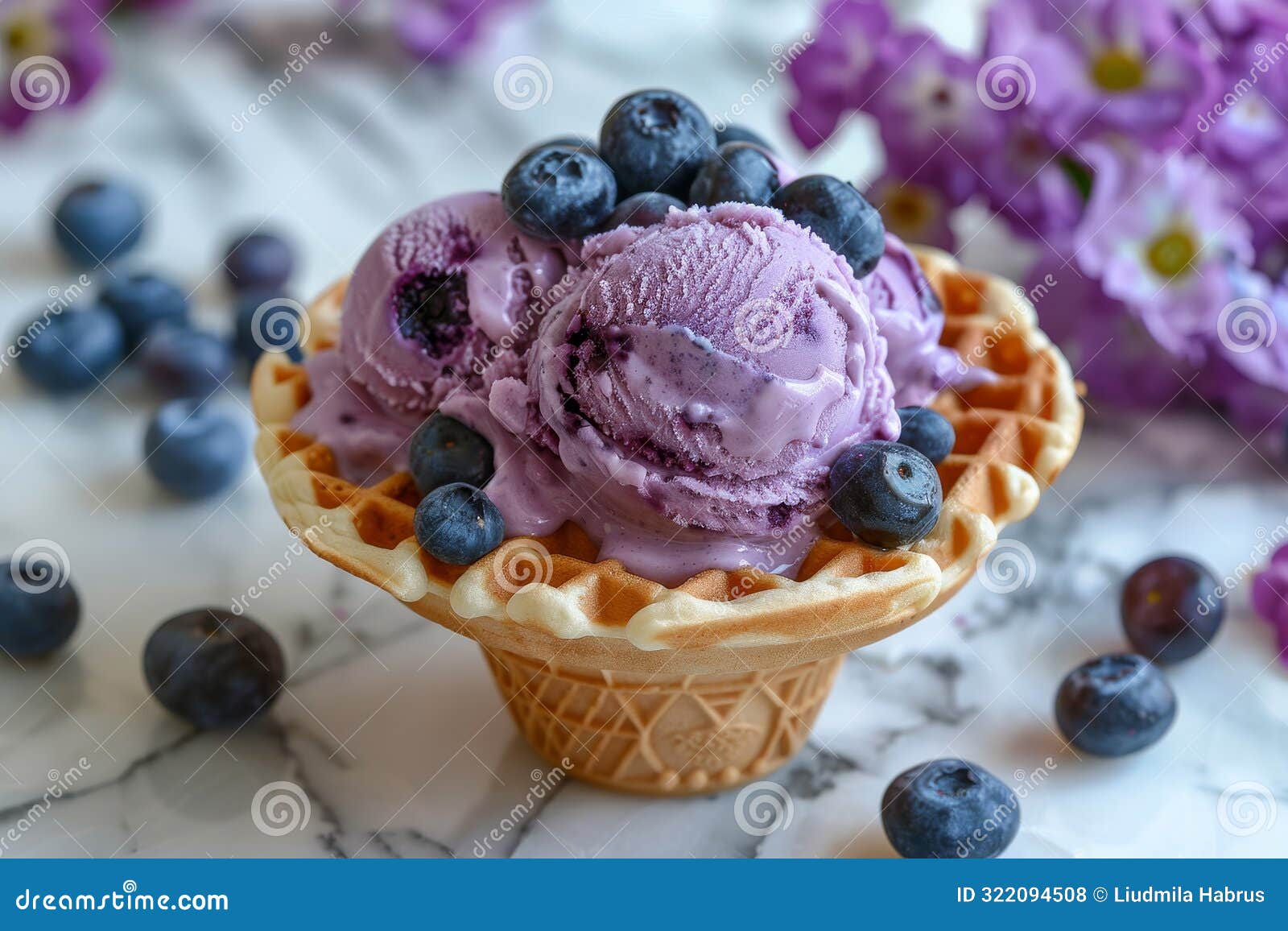 A Blueberry Ice Cream Cone with Blueberries on the Side Stock Photo ...