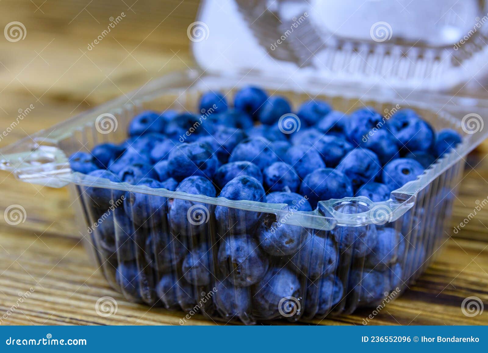 Blueberry in Plastic Box on a Wooden Table Stock Photo - Image of ...