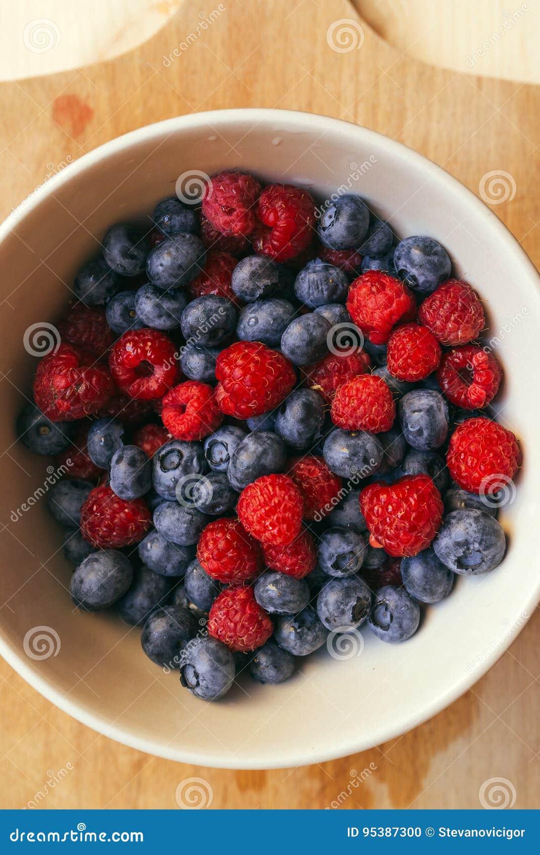 Blueberry and Raspberry Mix in White Ceramic Bowl Stock Photo - Image ...