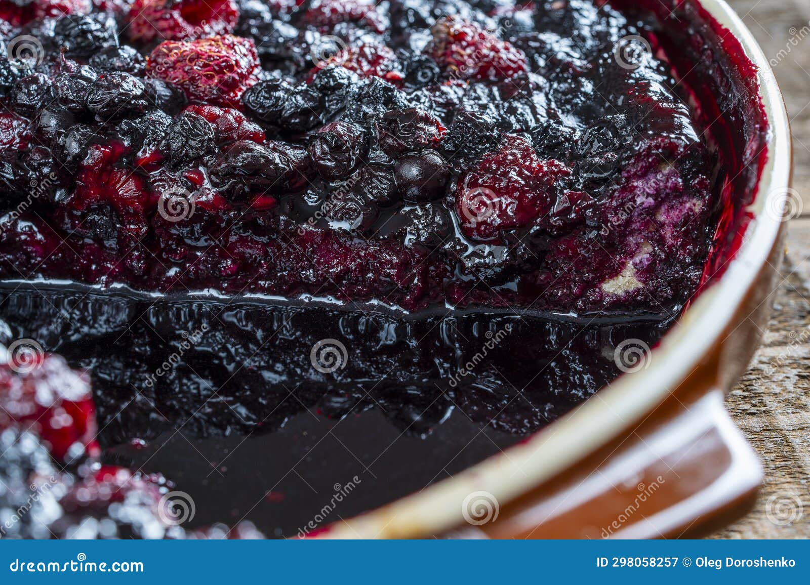 Blueberry and Raspberry Pie in a Ceramic Dish on the Table, Closeup ...