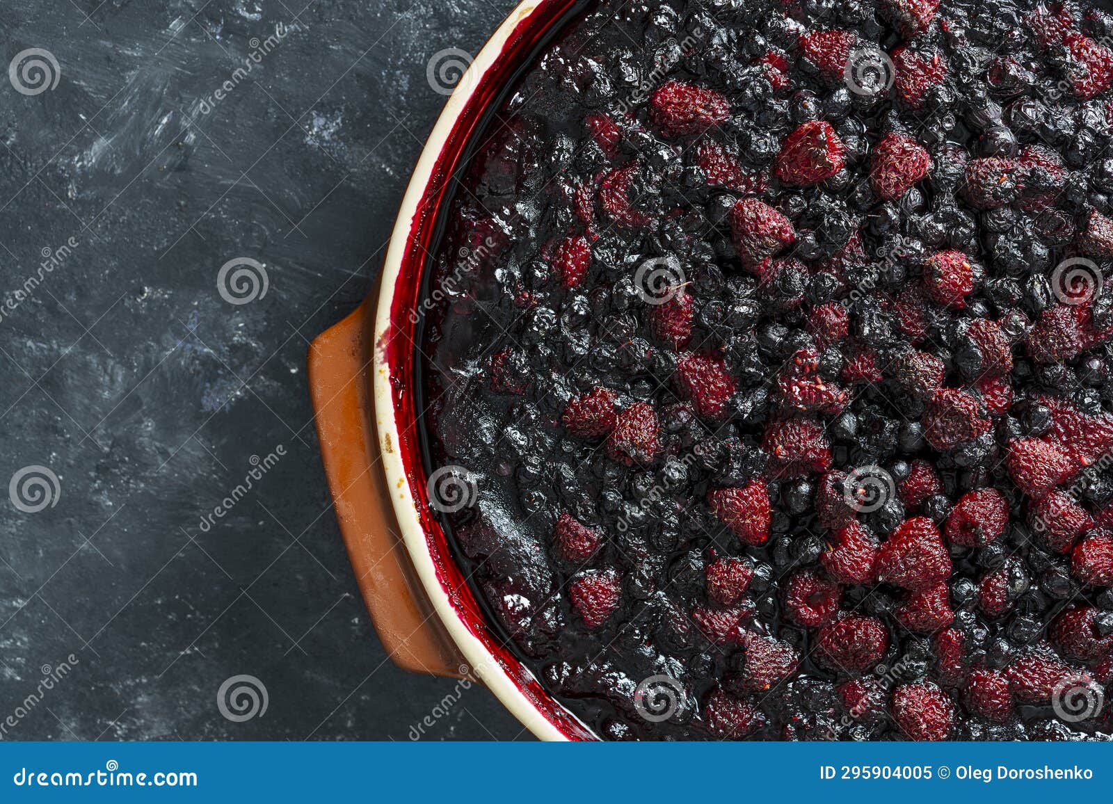 Blueberry and Raspberry Pie in a Ceramic Dish on the Table, Closeup ...