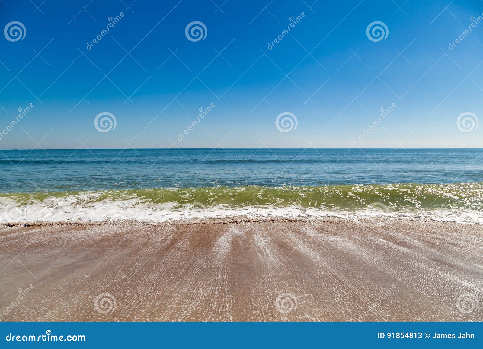 A Wave Pulling Back on a Sandy Beach in Florida. Stock Image - Image of ...